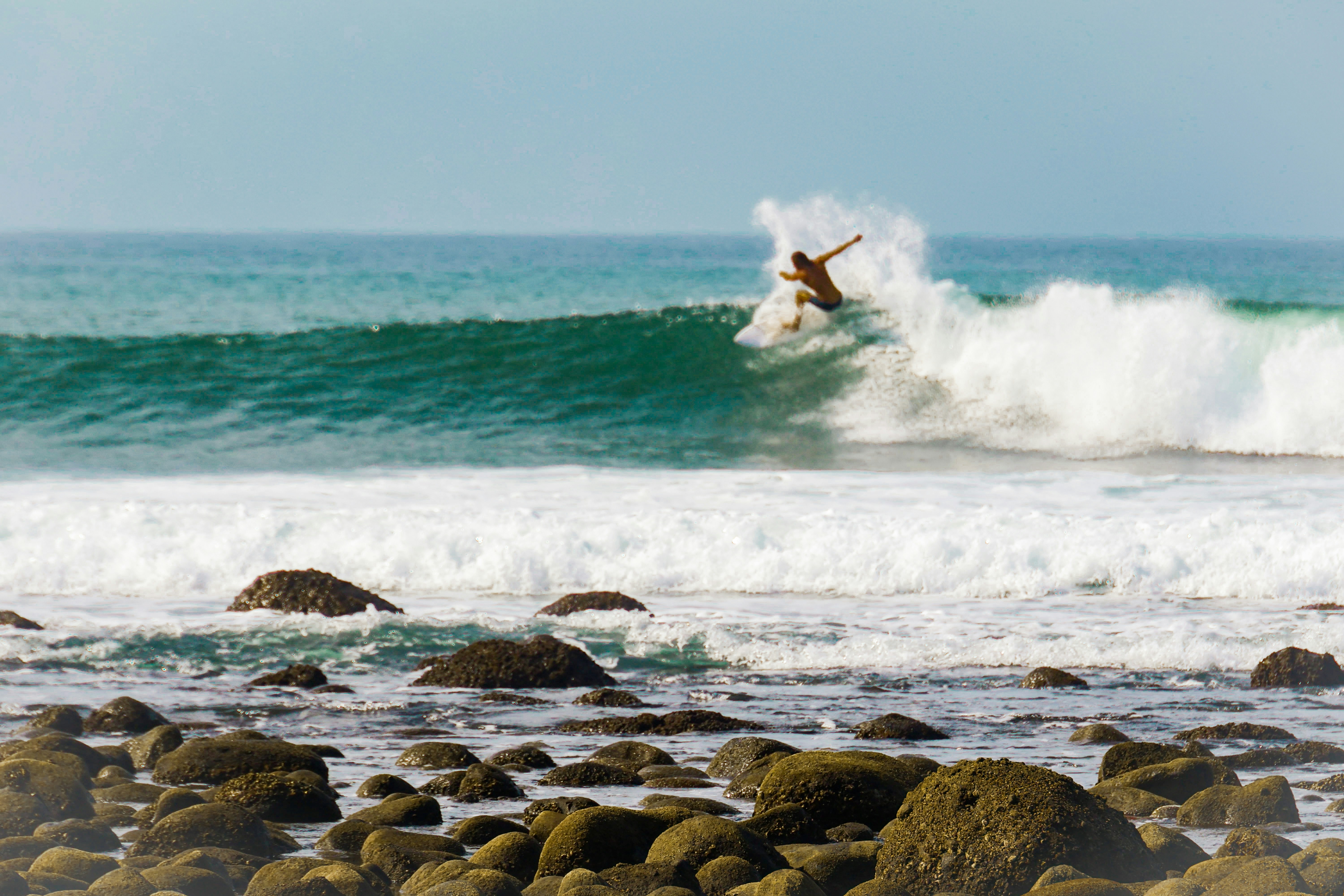Cresting Wave Acrobat on a Pacific Break