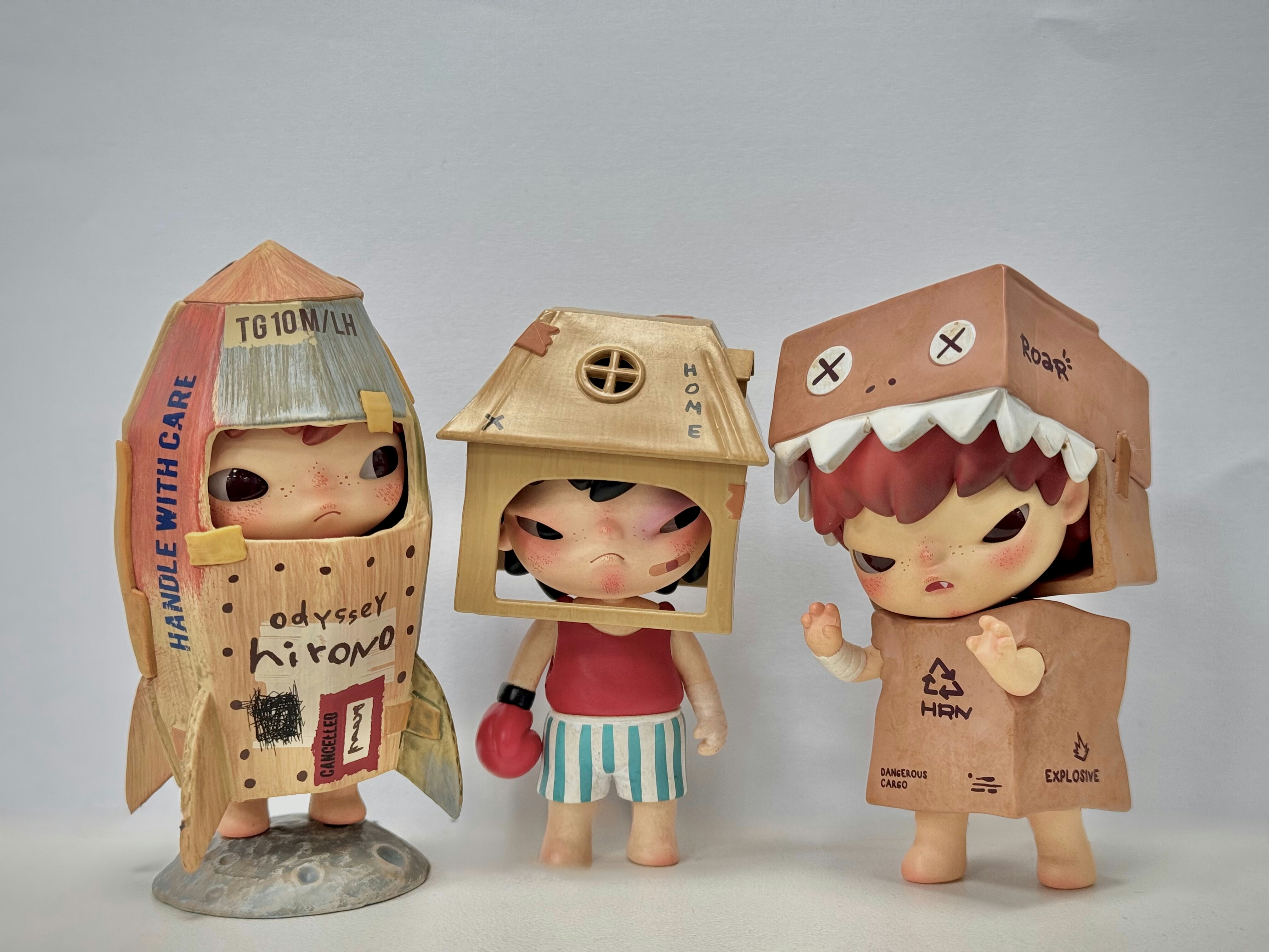 Three figures are wearing creative cardboard costumes. photo – Free ...