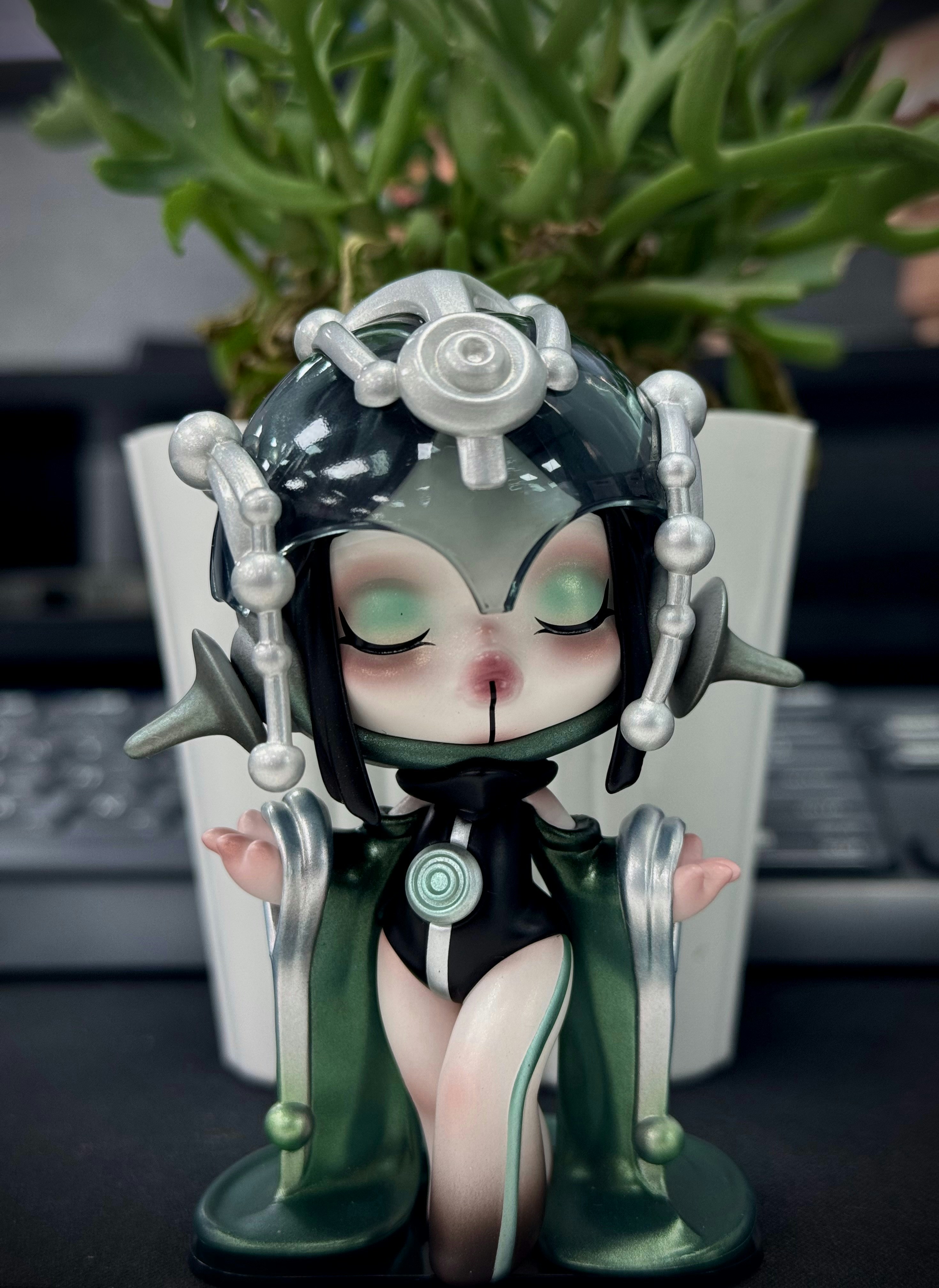 Crowned Automaton Among Saplings: A Tiny Cybernetic Priestess on the Desk