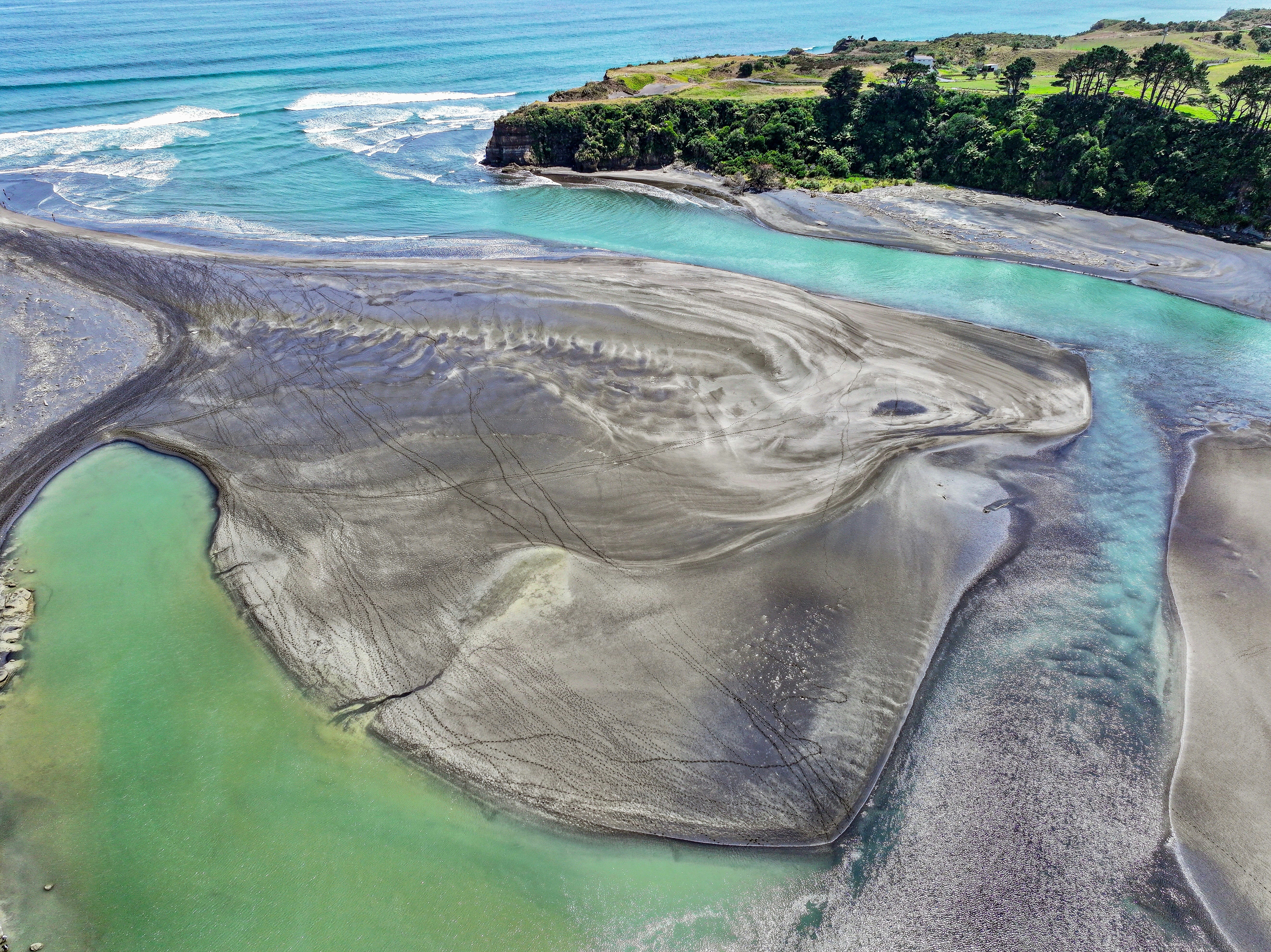 Mudflats Converge with Turquoise Edges: A Coastal Sandscape from Above