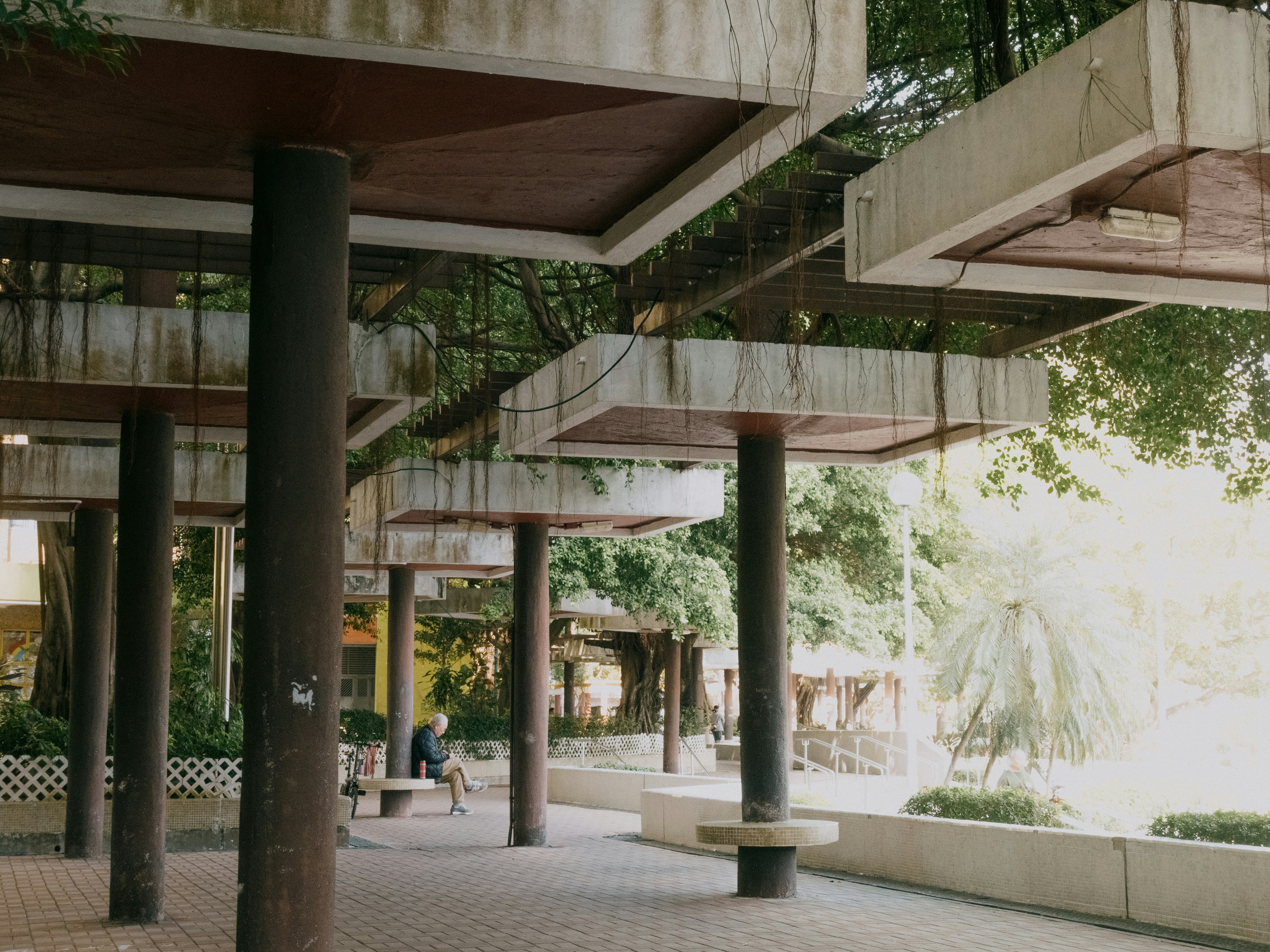 Pillared structure with square roofs in a park. photo – Free Building ...