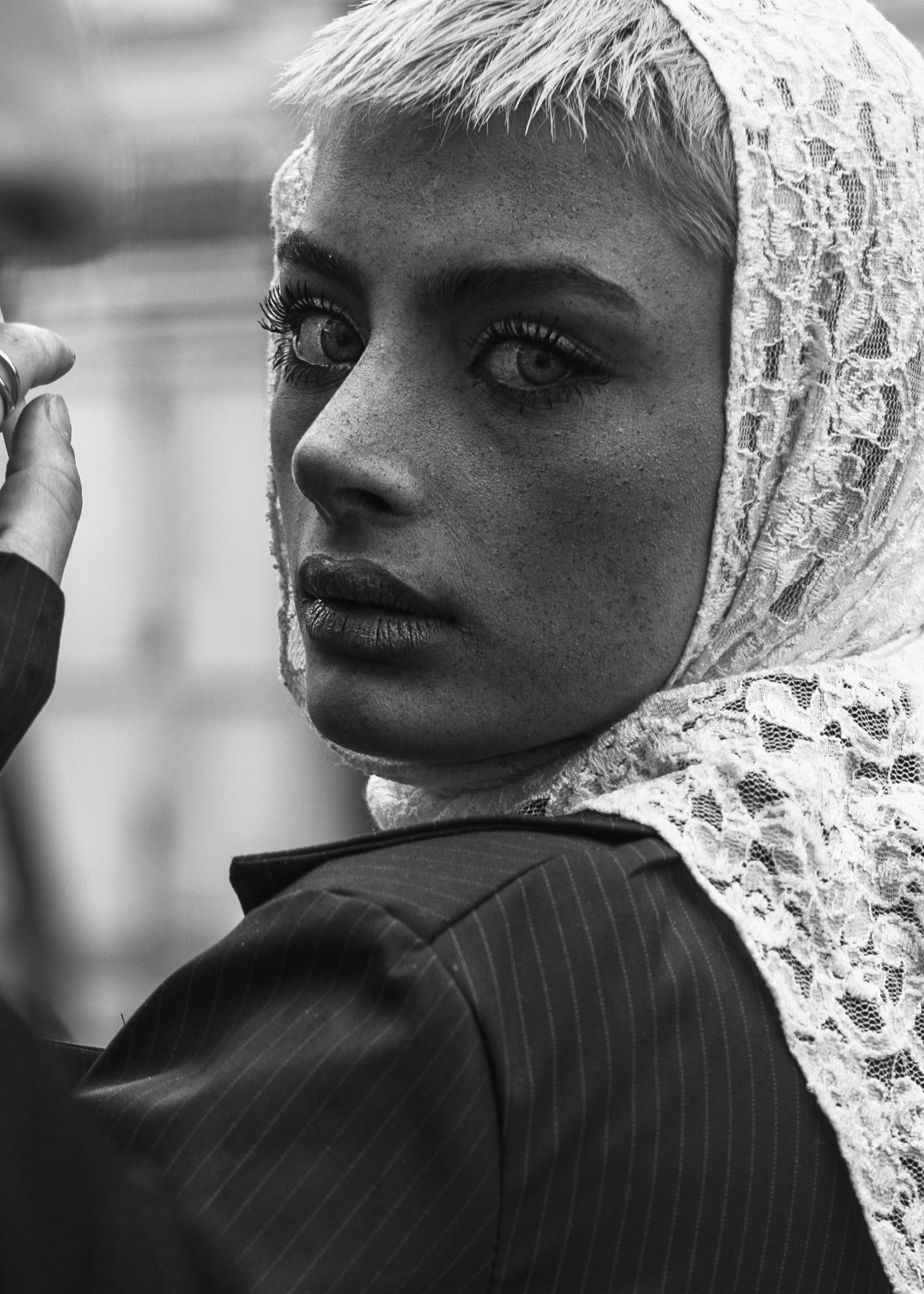A woman poses, wearing a lace head covering. photo – Free Portrait ...
