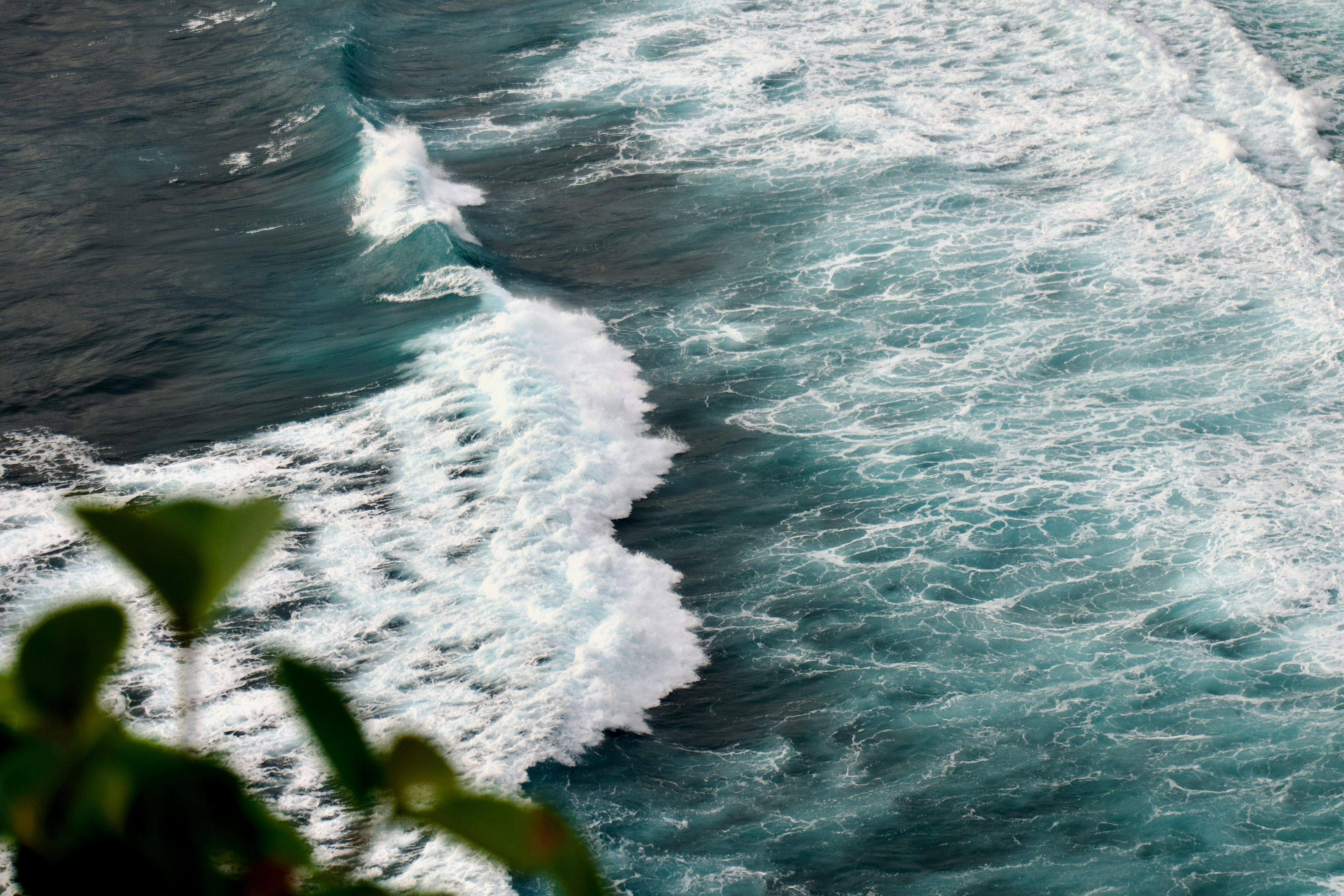Waves crash along the shoreline, creating a beautiful scene. photo ...