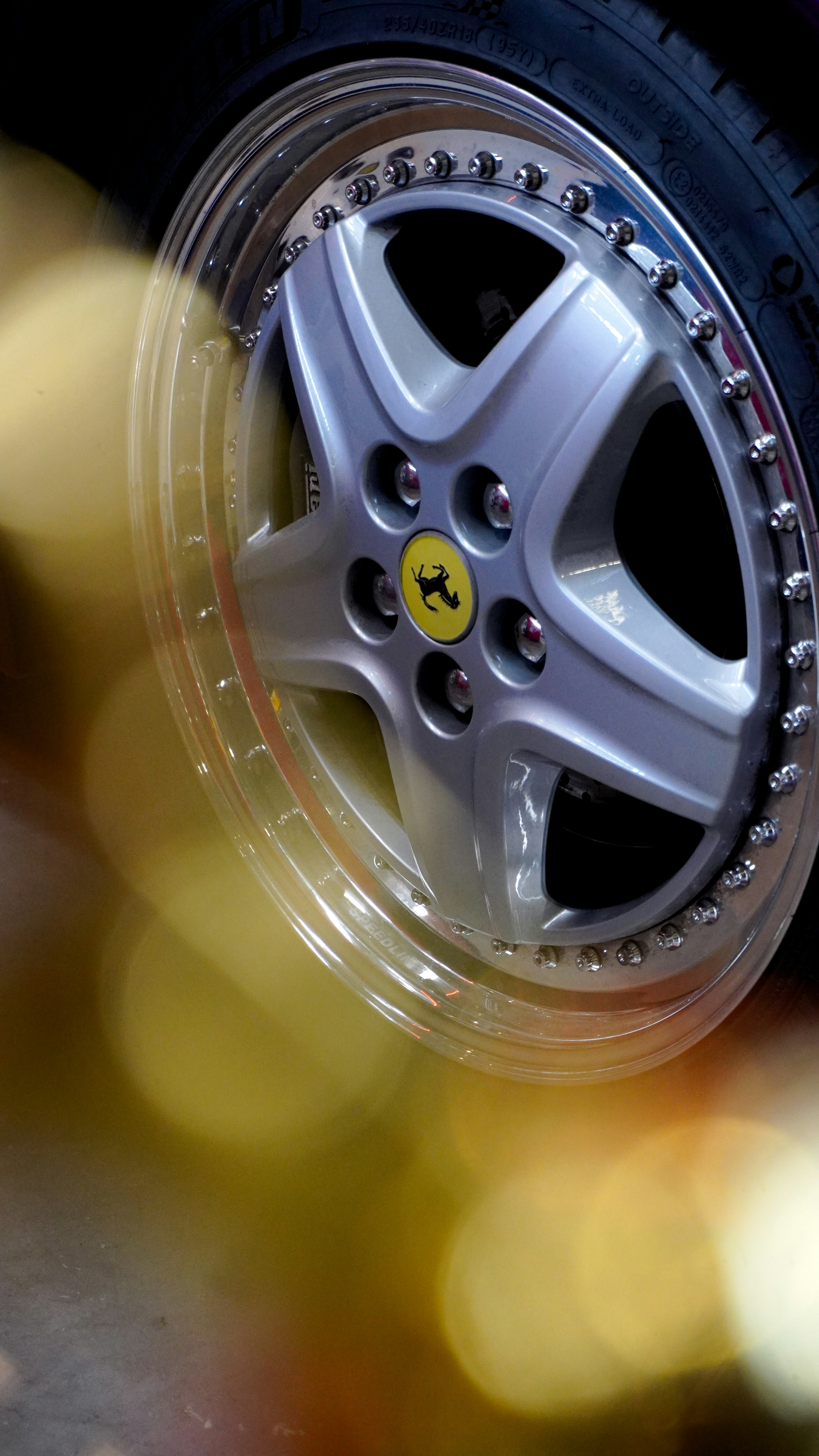 A ferrari wheel shows the famous logo. photo – Free Ferrari Image on ...