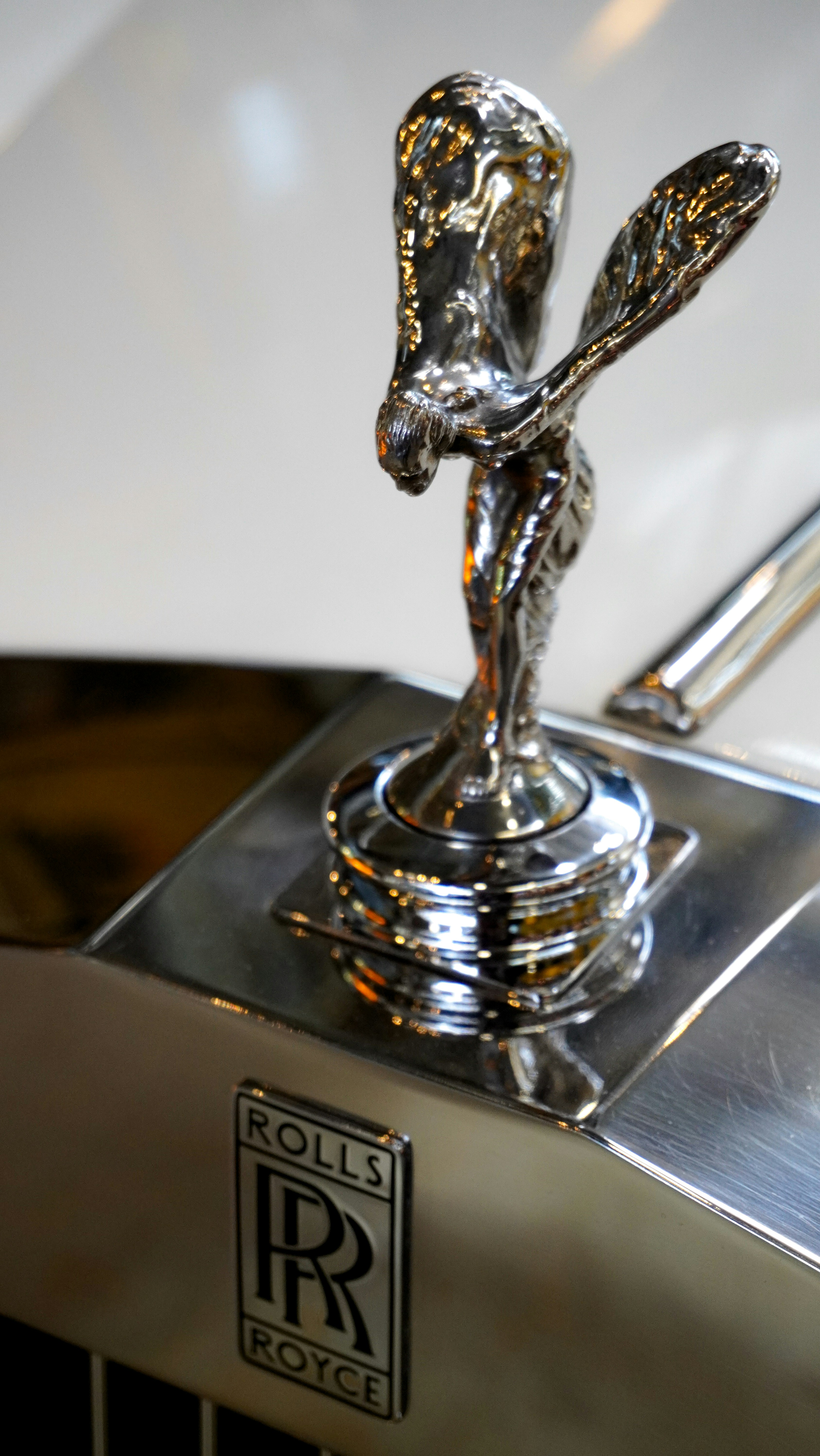 Chrome Guardian: The Spirit of Ecstasy Over a Rolls-Royce Grille