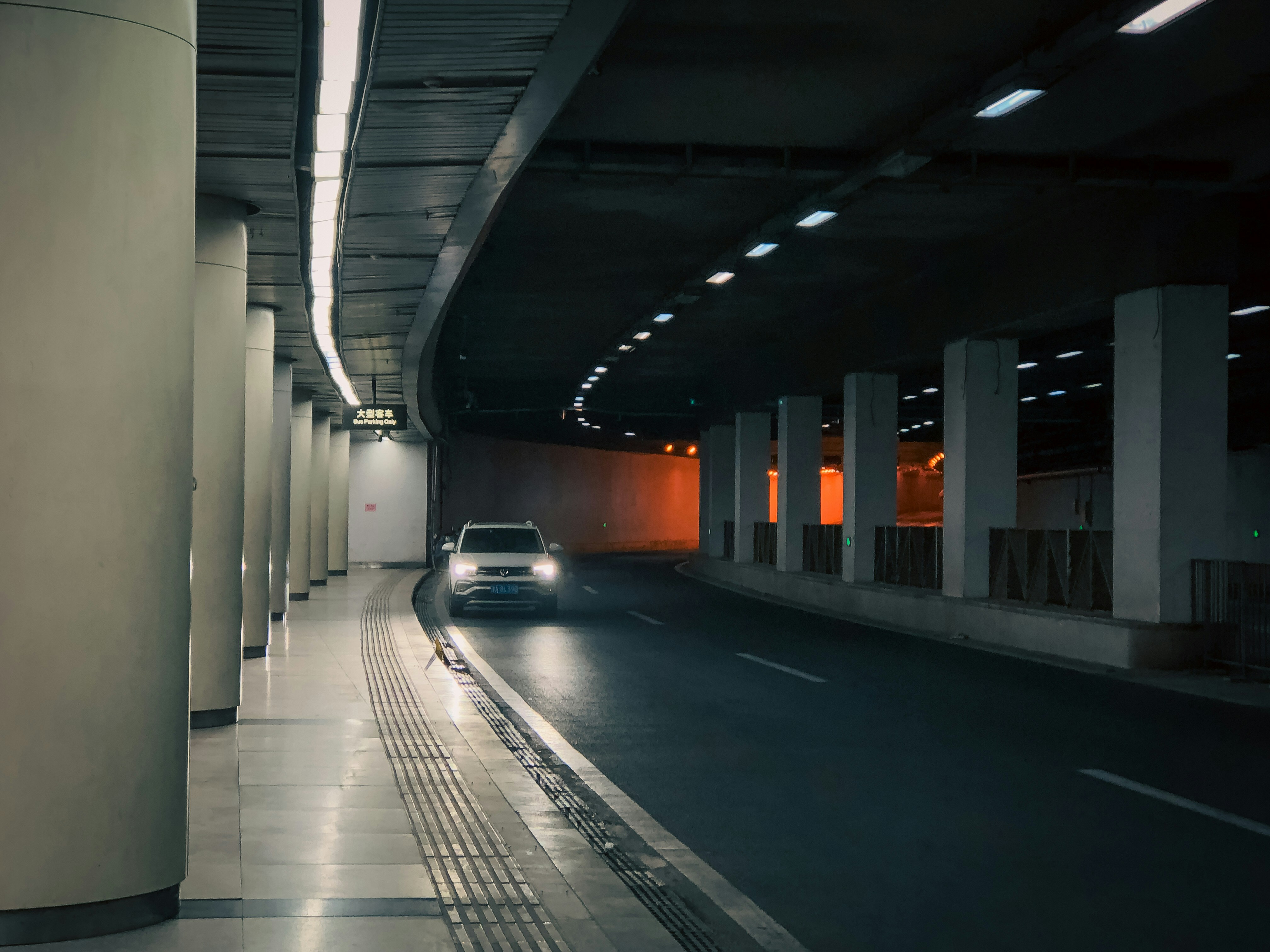 A car parking beside, in the underground tunnel