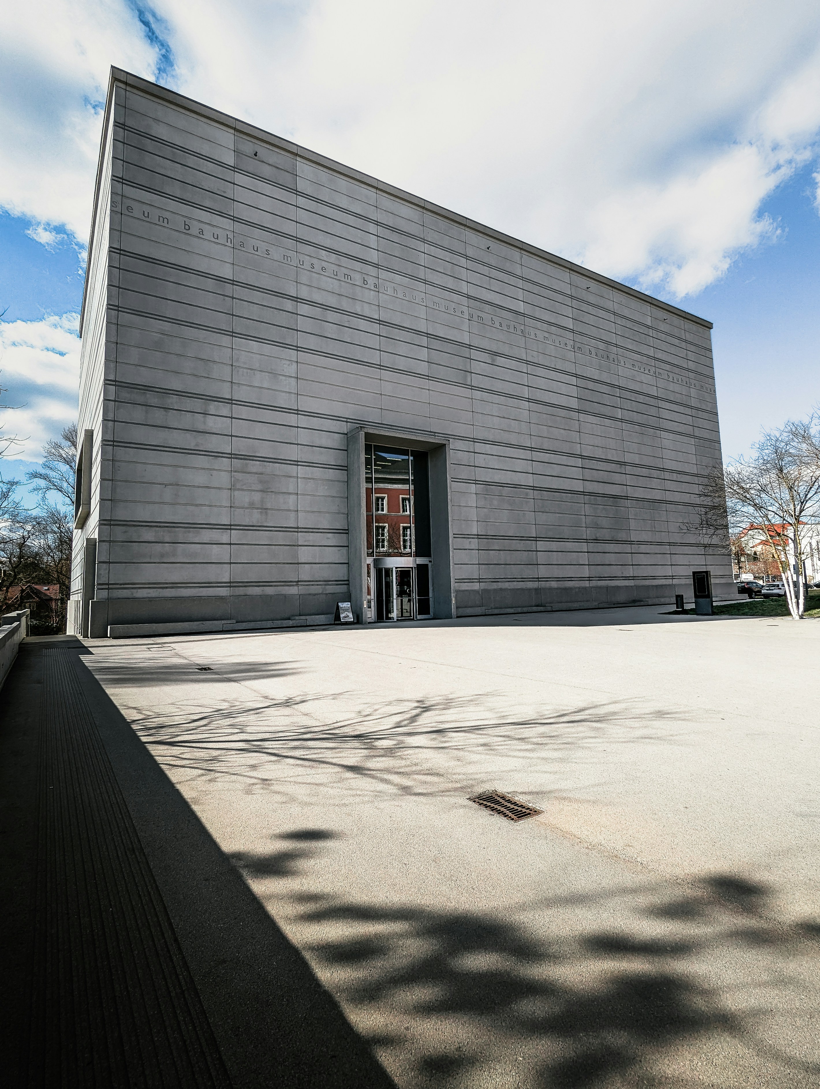 A modern, gray building on a bright day. photo – Free Building Image on ...