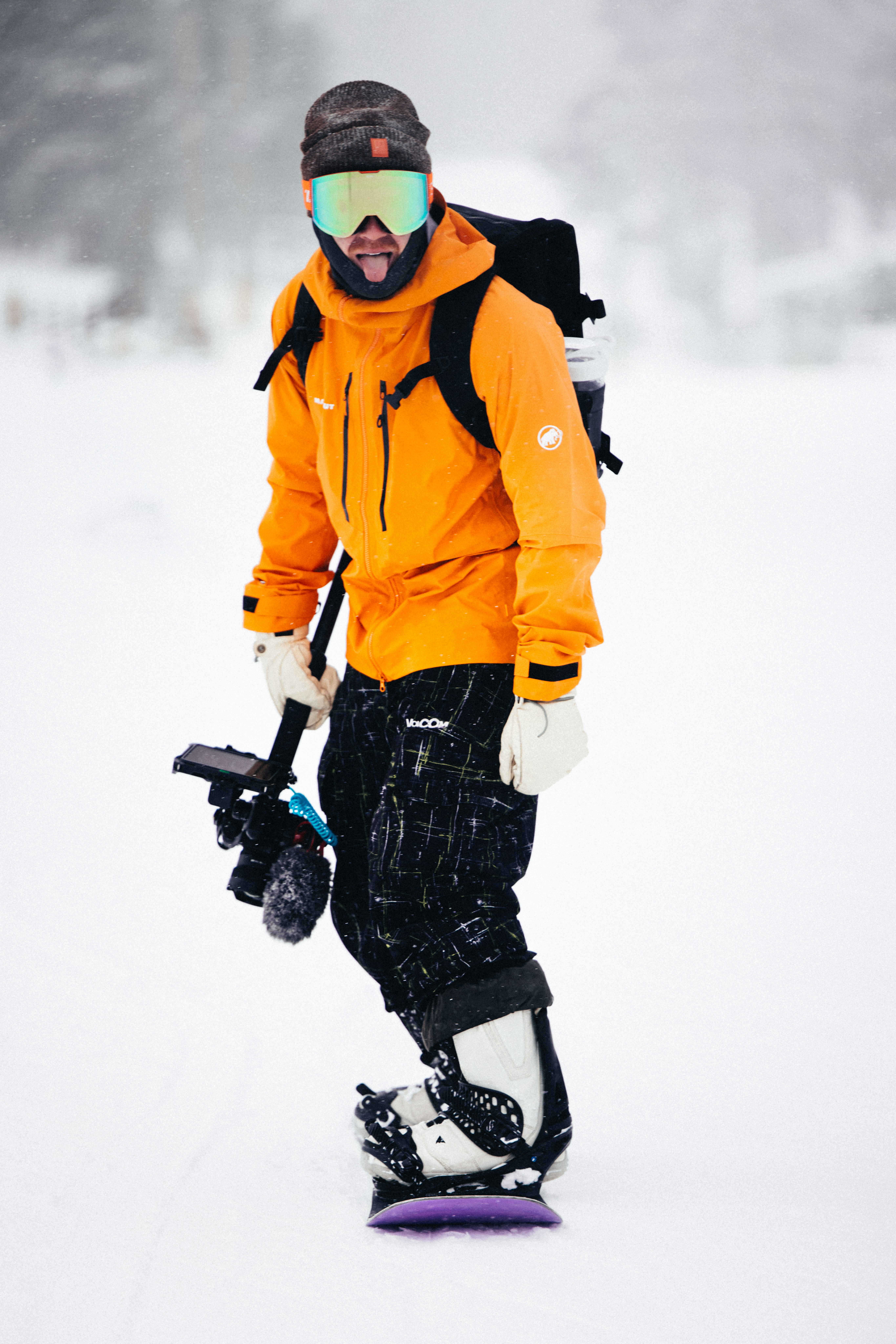 A snowboarder with gear ready to hit the slopes. photo – Free Portrait ...