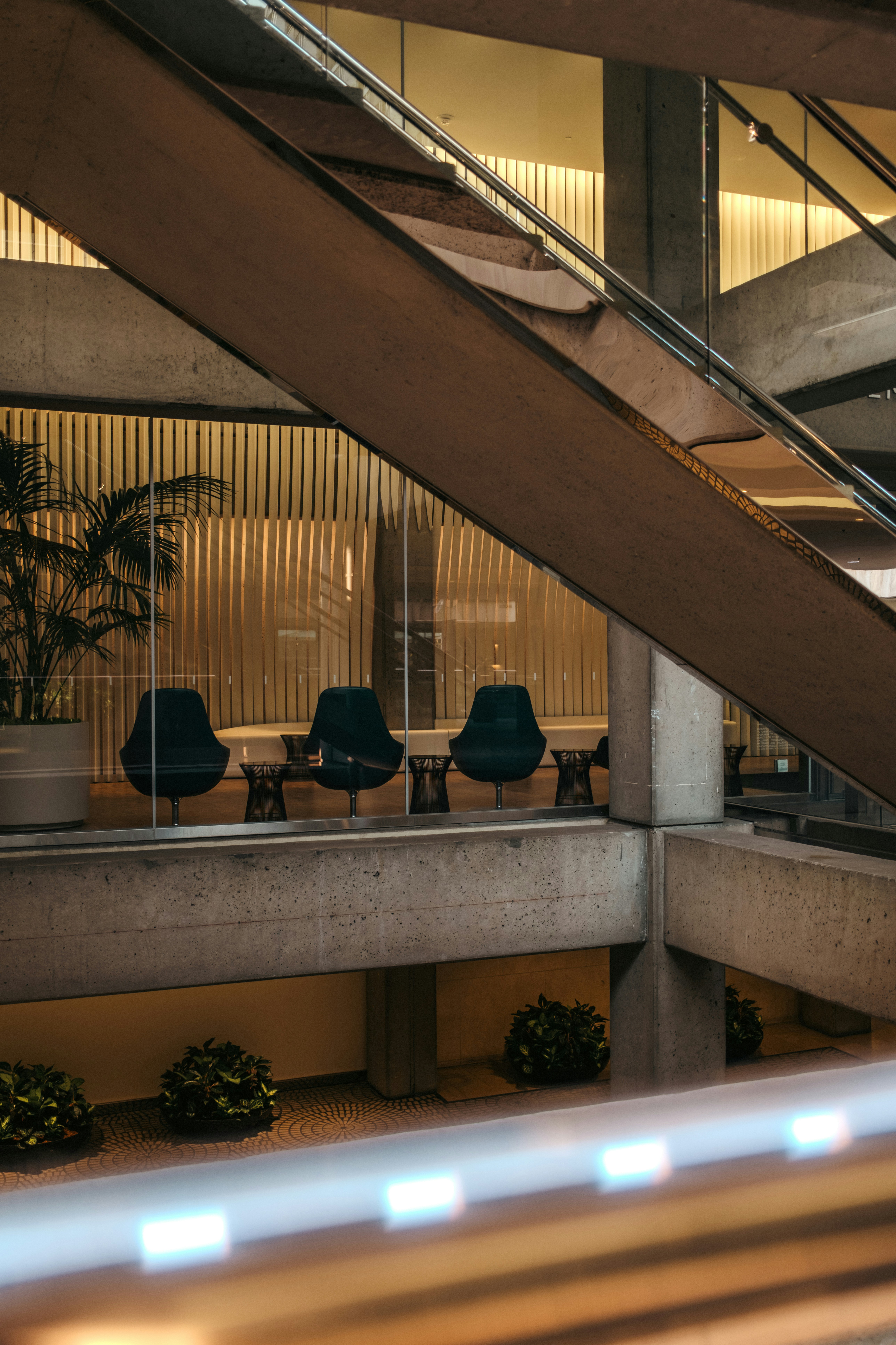 A modern building interior features seating and stairs. photo – Free ...