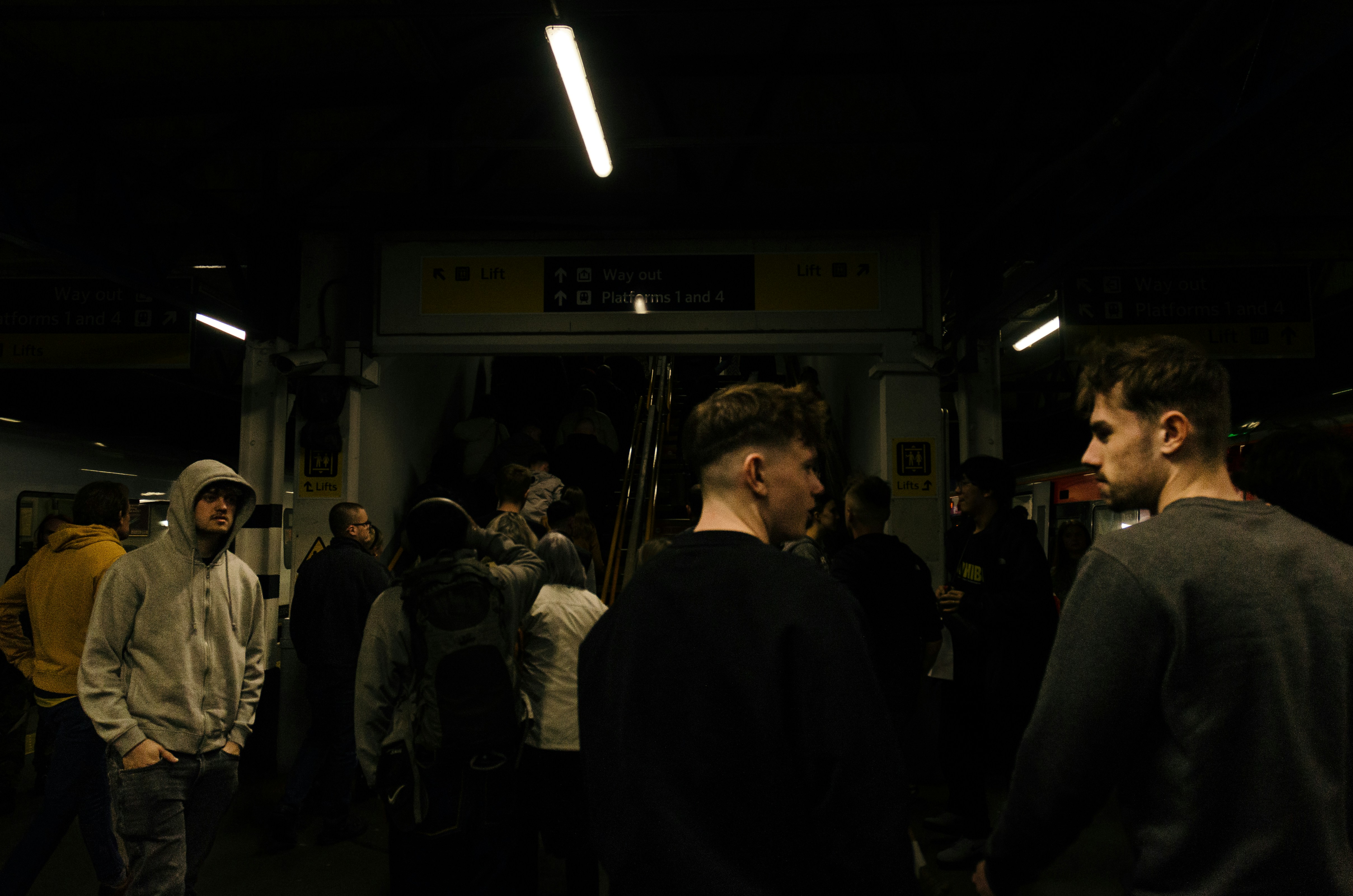 Underground Convergence: A Quiet Exchange Beneath Fluorescent Light
