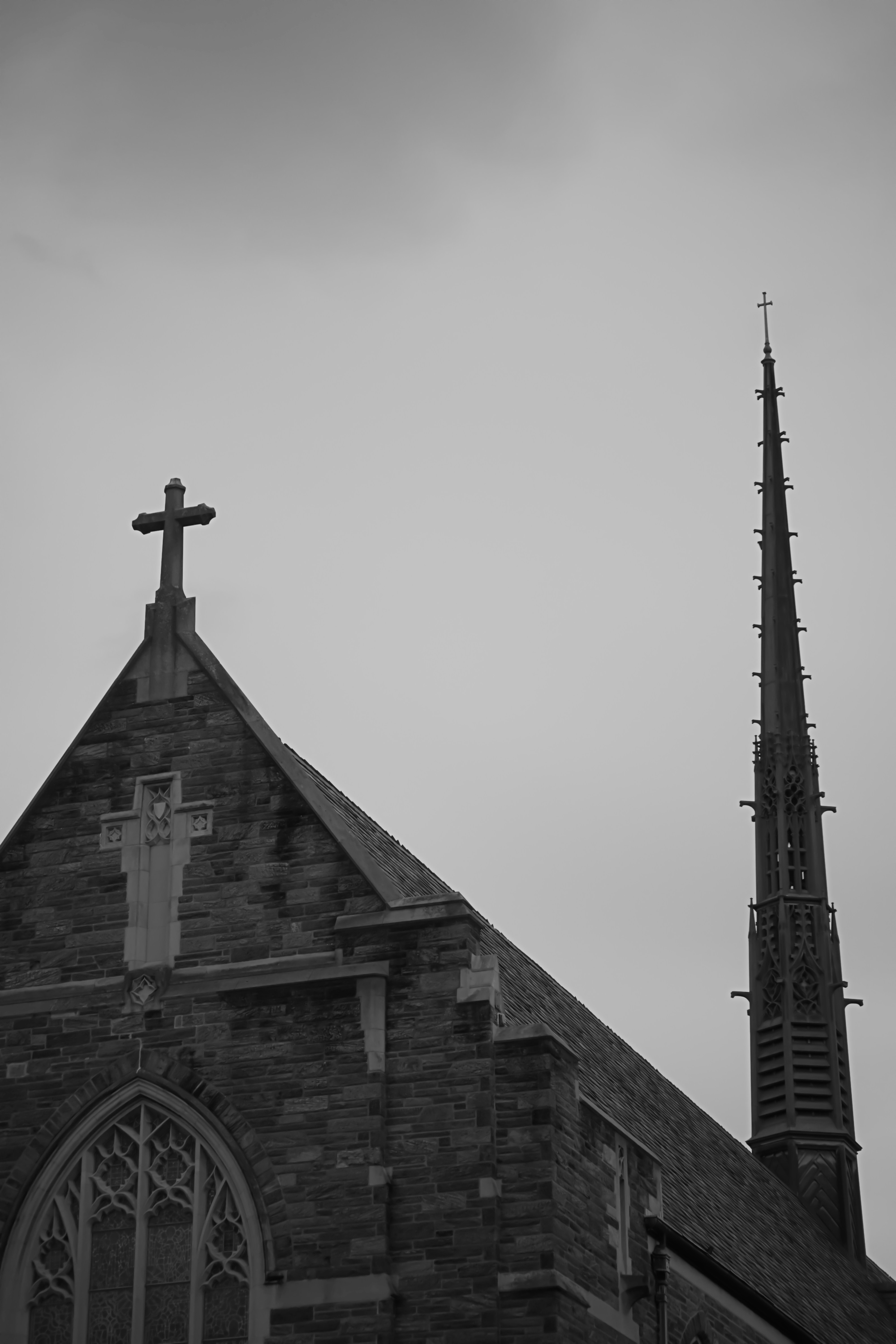 A church's steeple towers under a gray sky. photo – Free Church Image ...