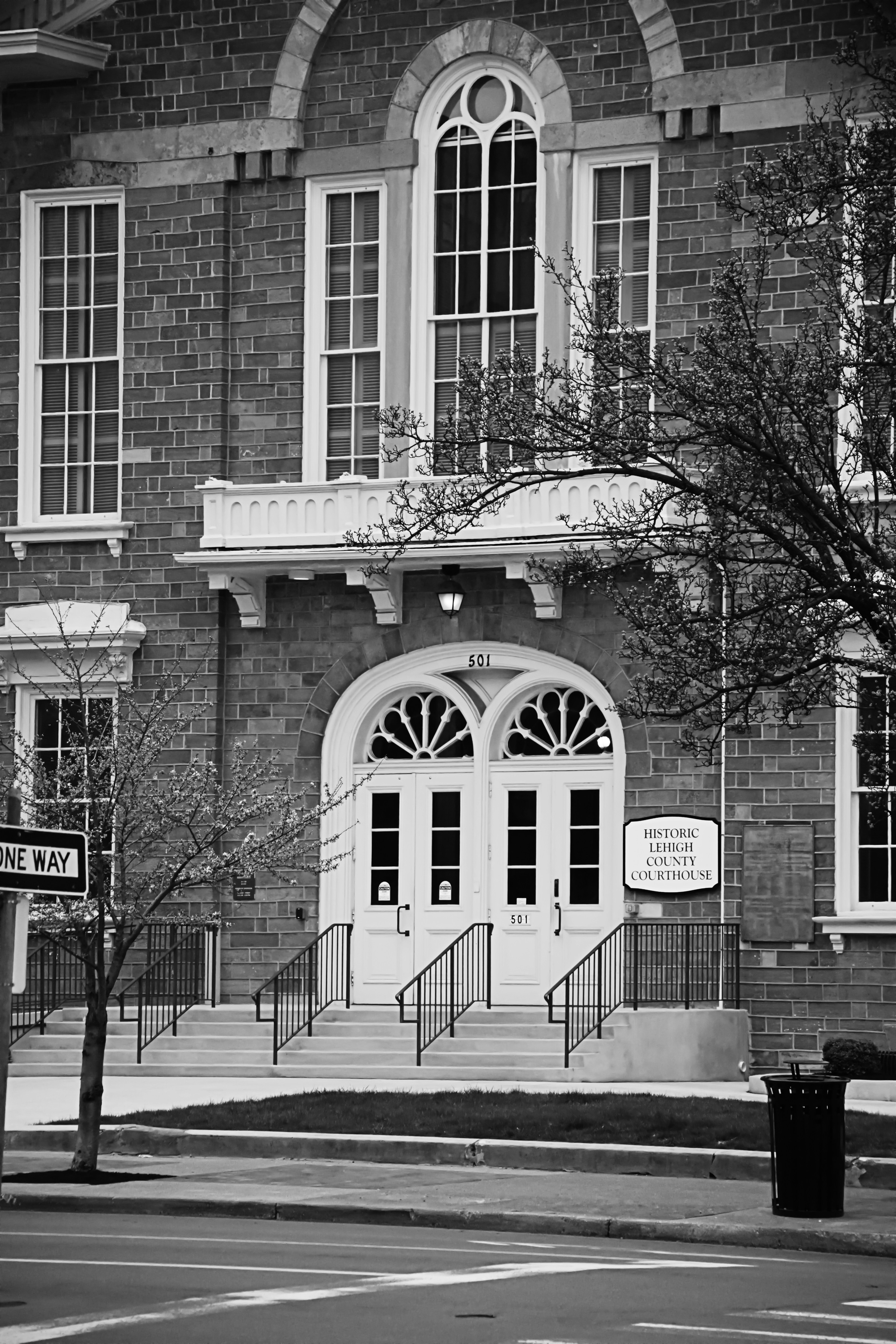 A stately brick building with multiple arched windows. photo – Free ...