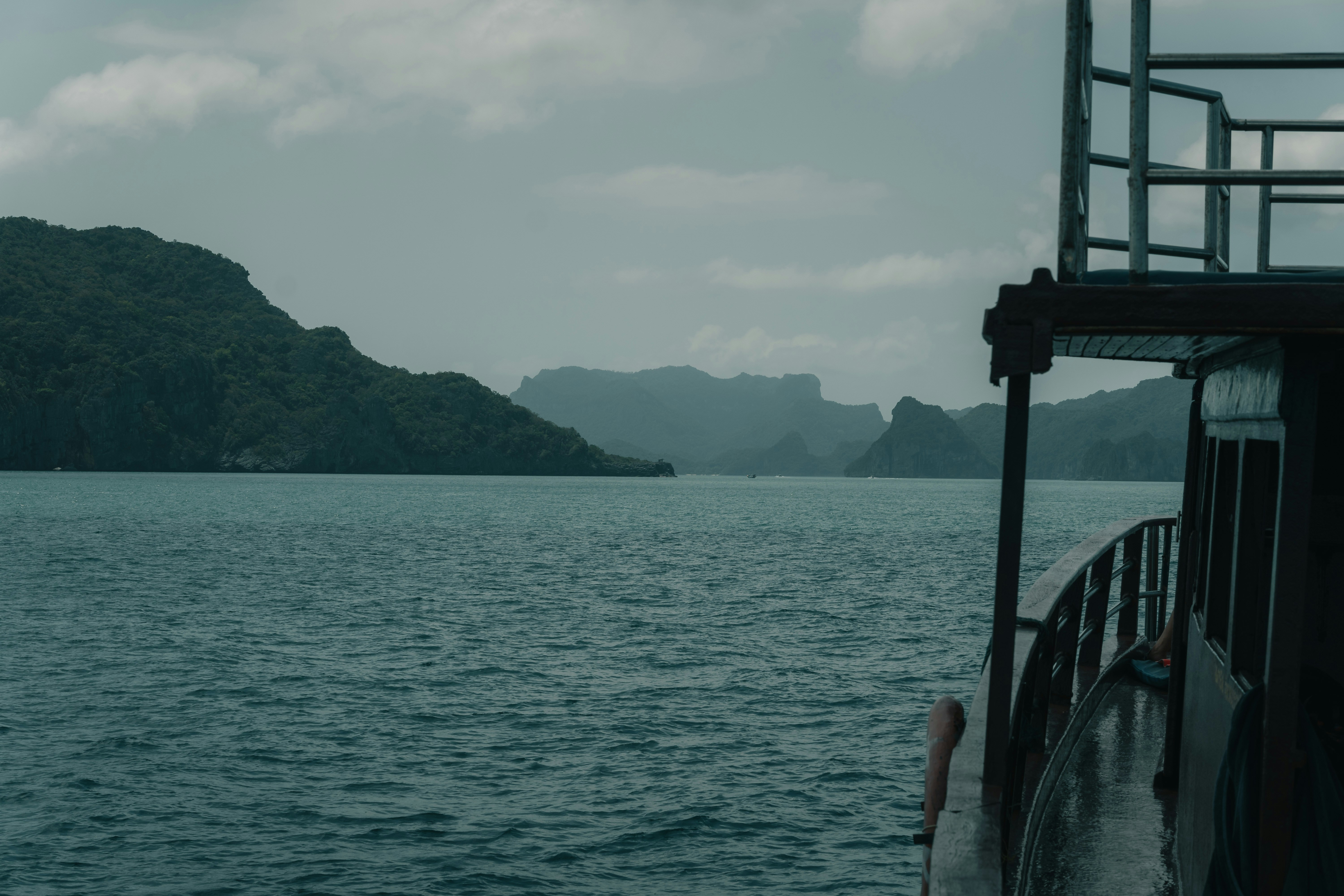 Edge of the Deck: Teal Waters and Distant Archipelago