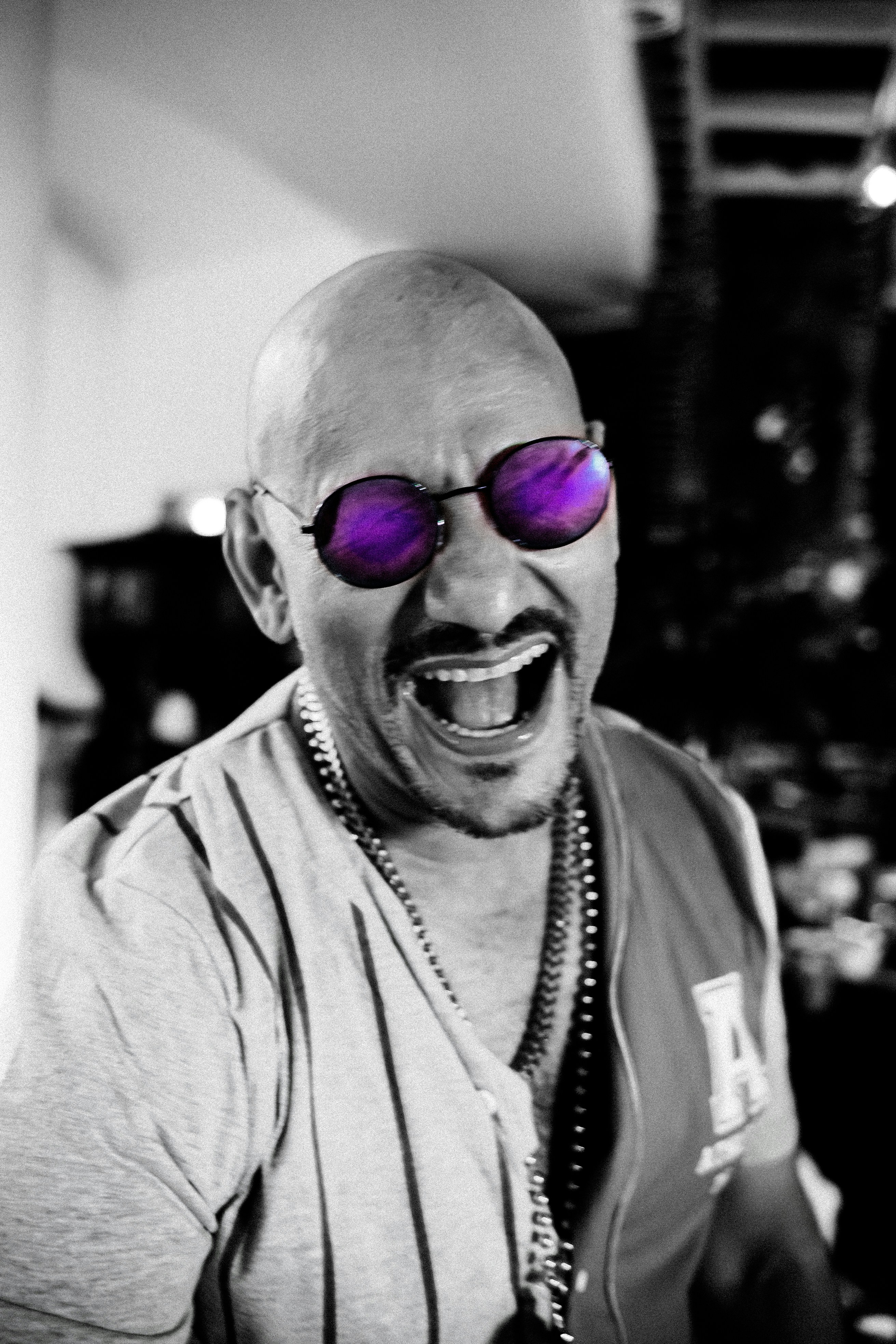 Purple-glass showman: a high-energy portrait in monochrome