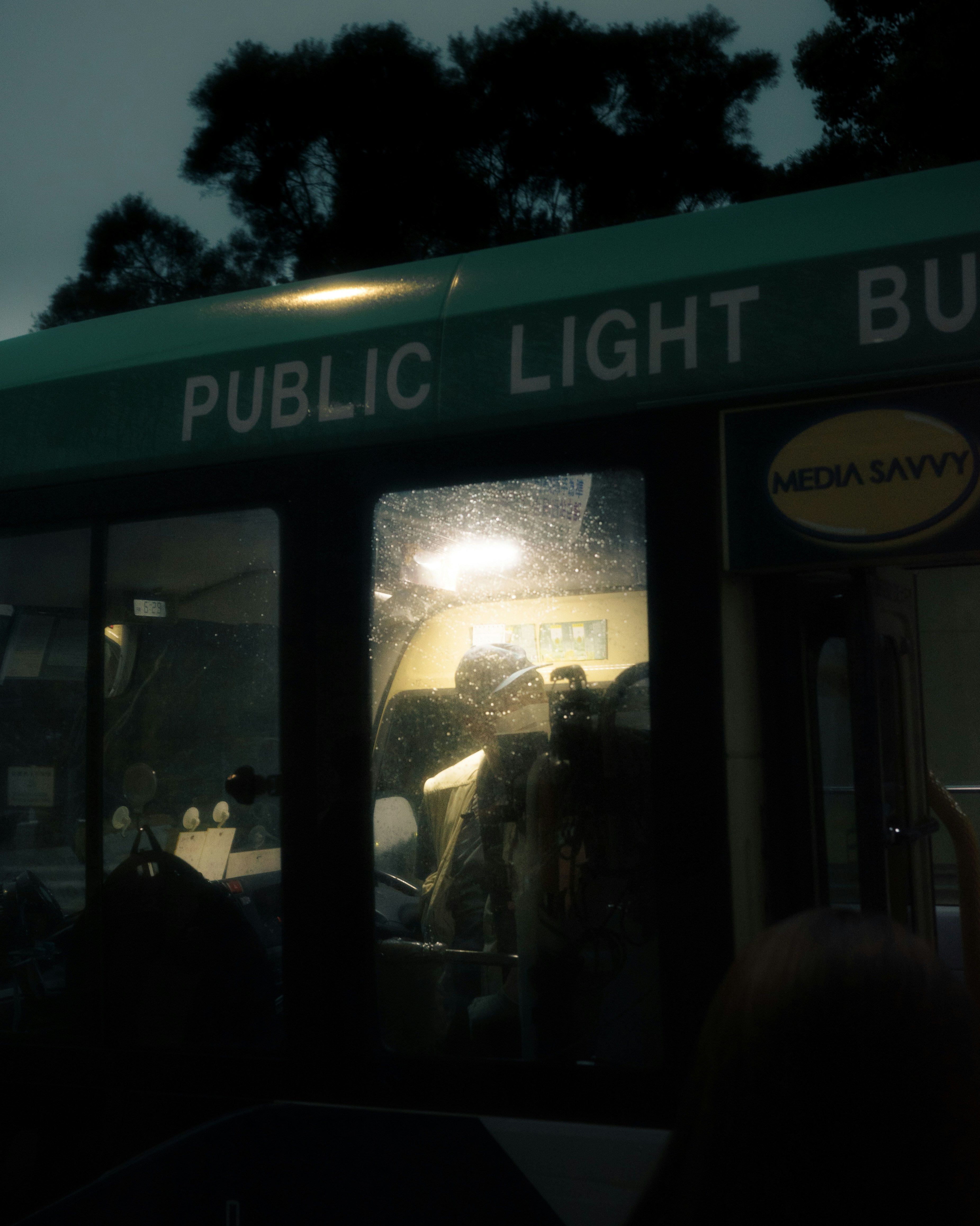 A public light bus lit up at night. photo – Free Hong kong Image on ...