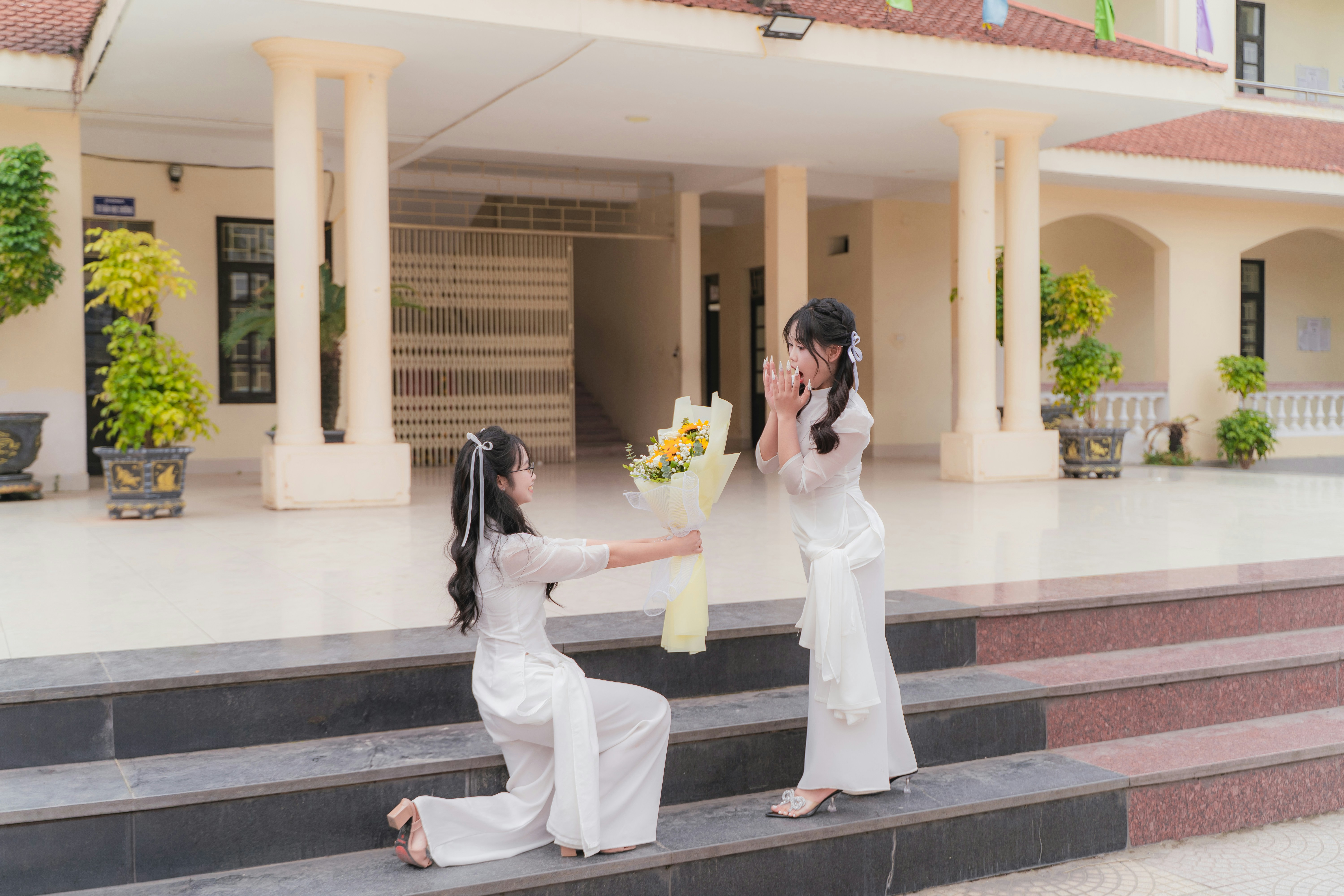 Bouquet Exchange on a Sunlit Campus Staircase