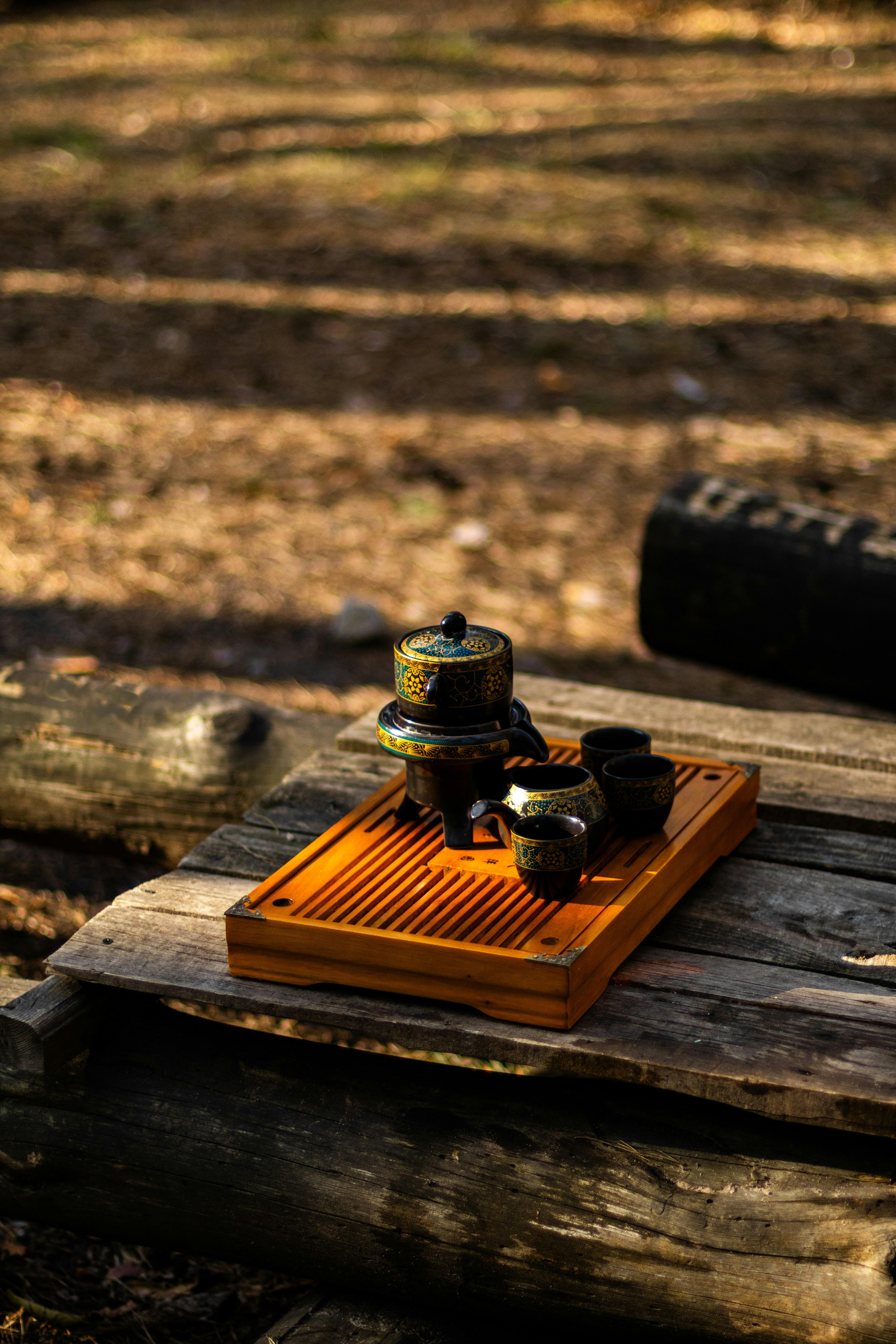 Tea set arranged on a wooden plank outdoors. photo – Free Forest Image ...