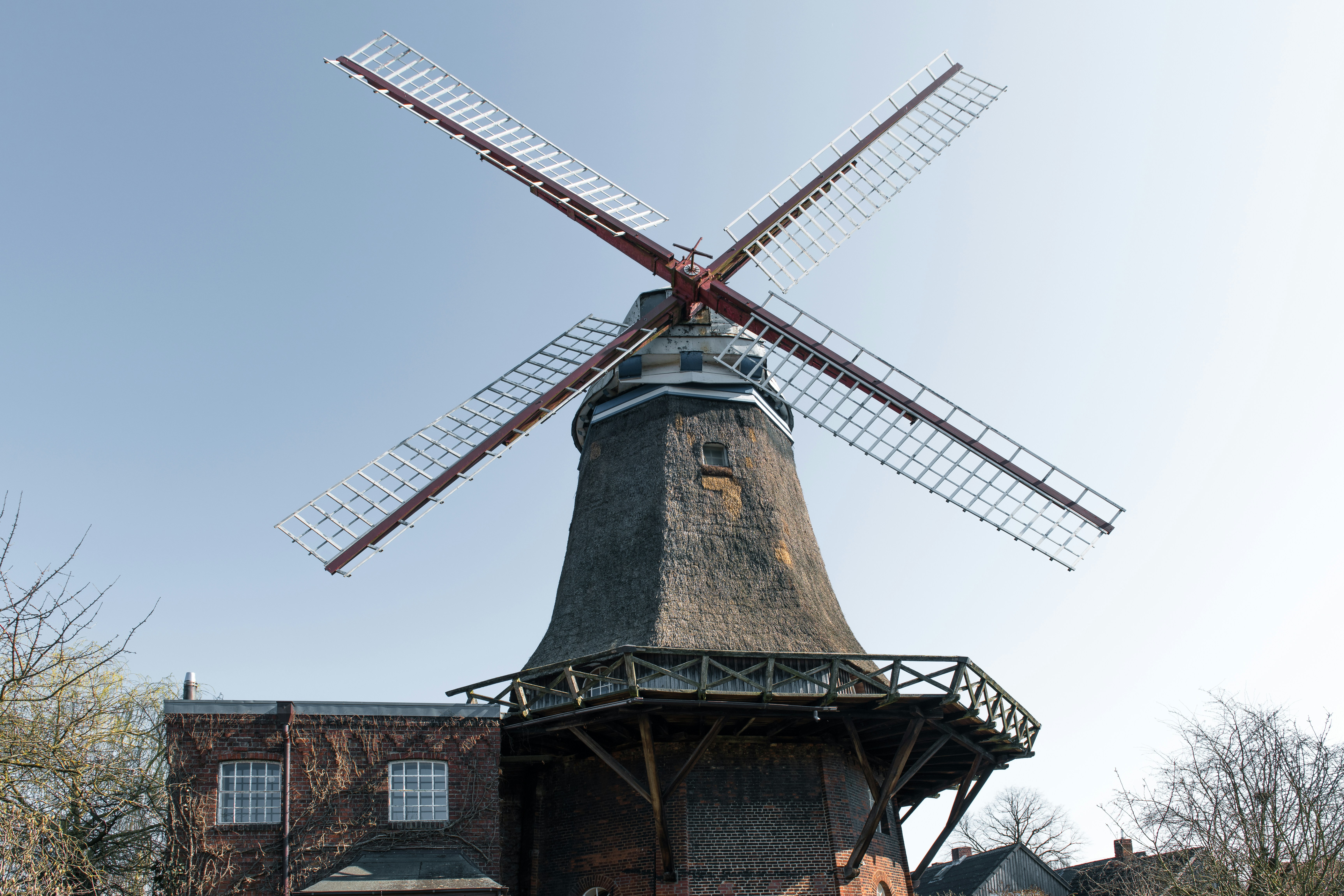 A classic windmill stands tall against a clear sky. photo – Free ...