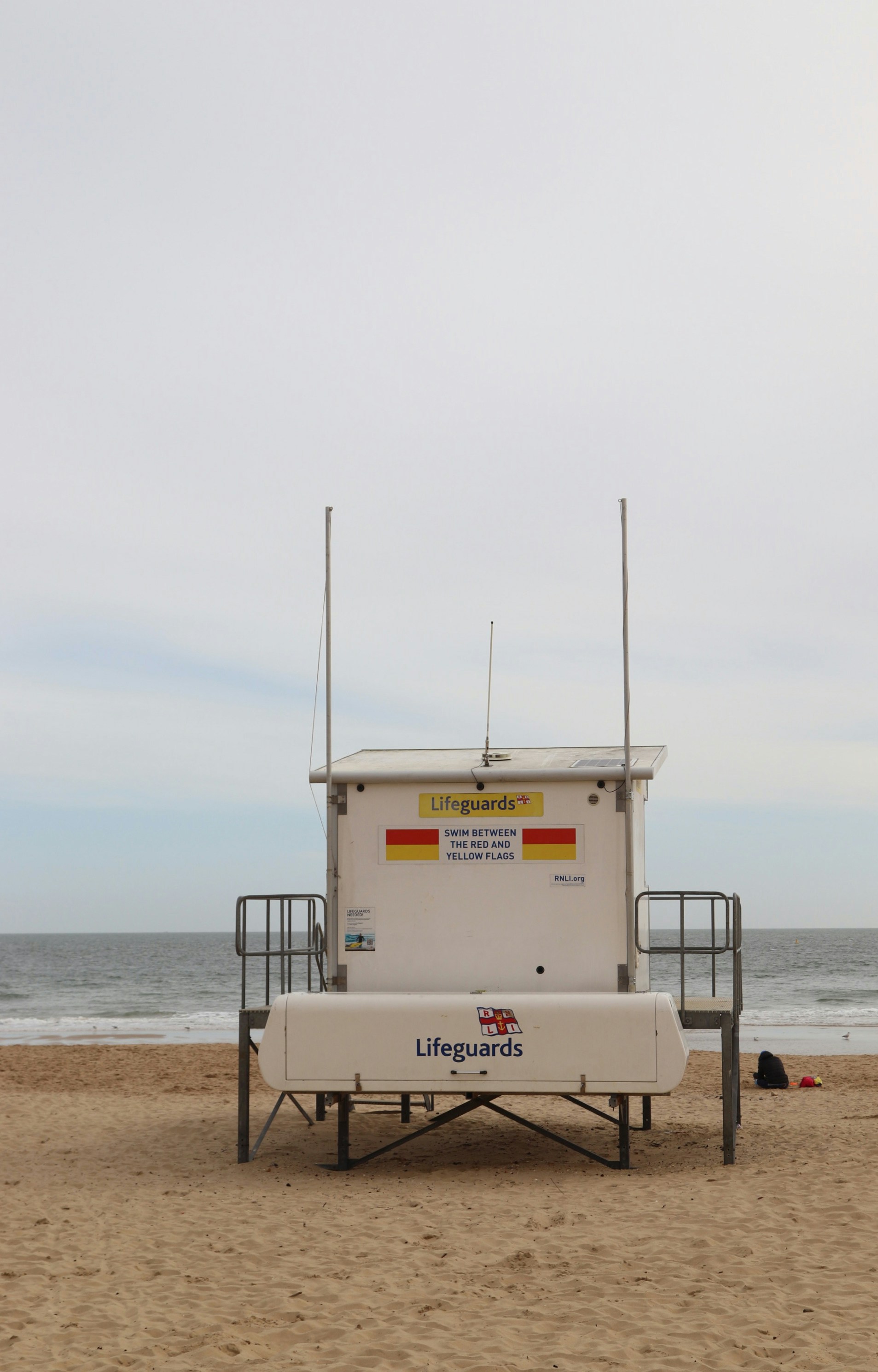 Sentinel on the Shore: The Lifeguard Post Quietly Overlooks a Calm Sea