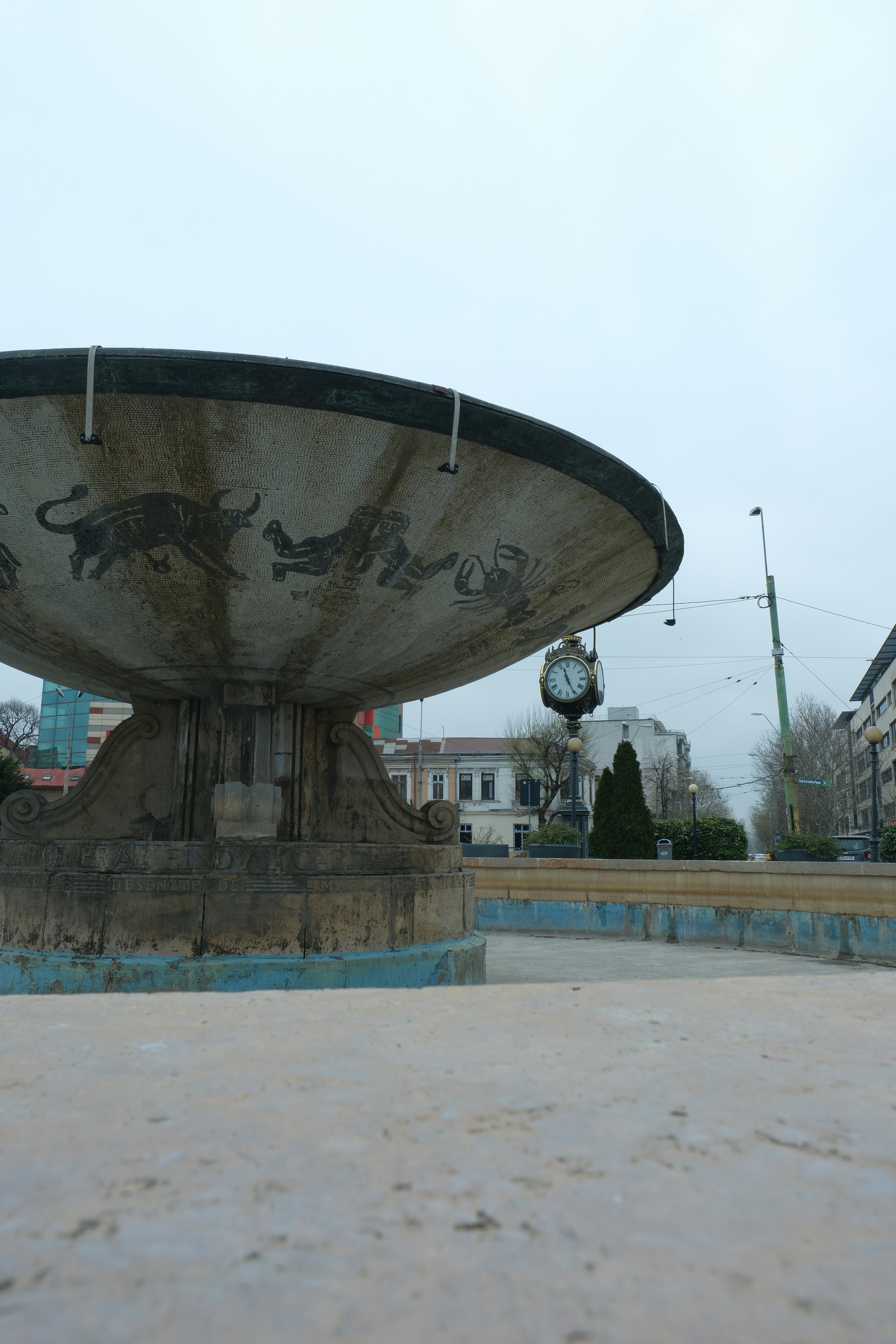 Timeworn Fountain Anchors a Quiet Clock Square