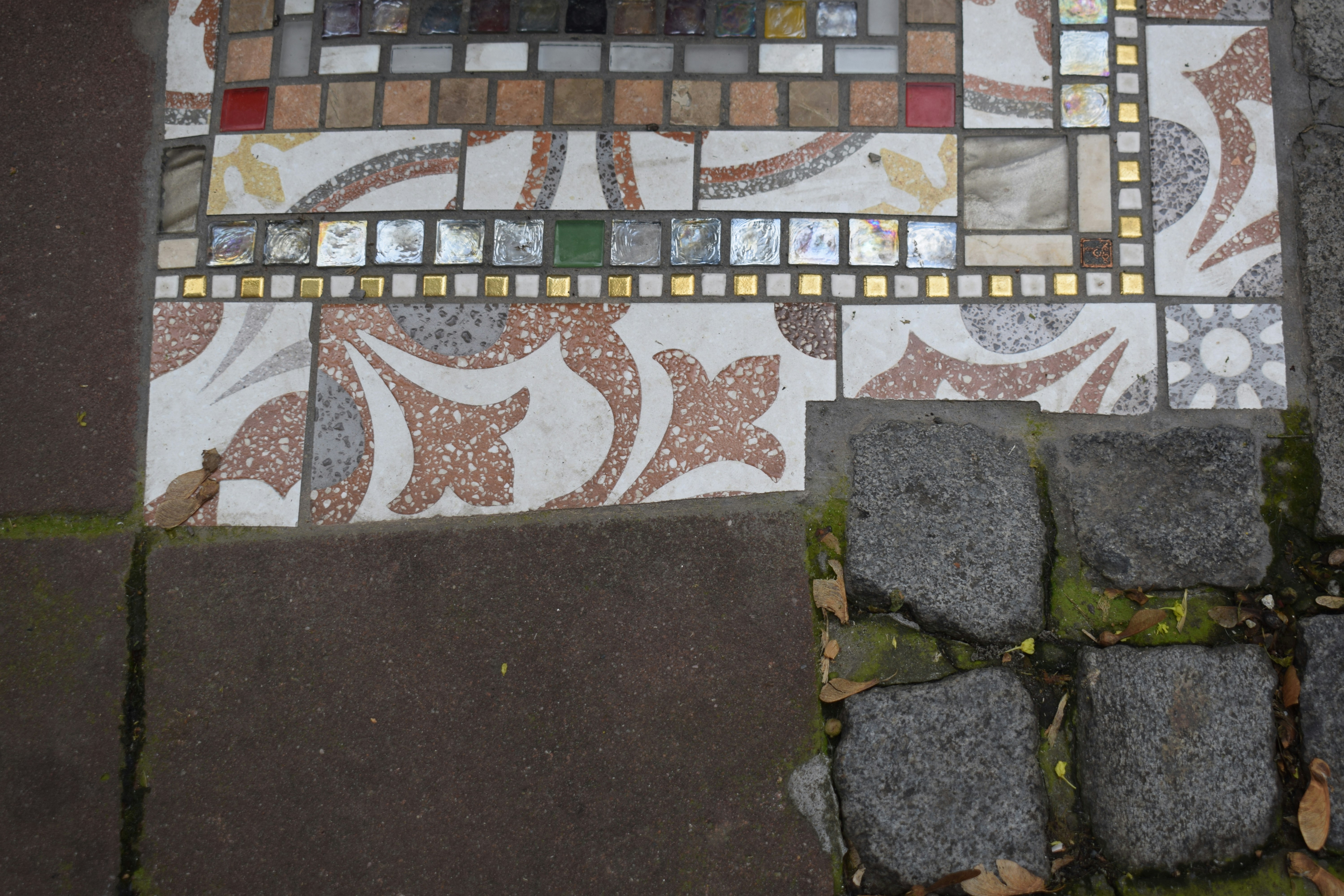 Mosaic Borders: A Quiet Corner of Patterned Tiles and Stone