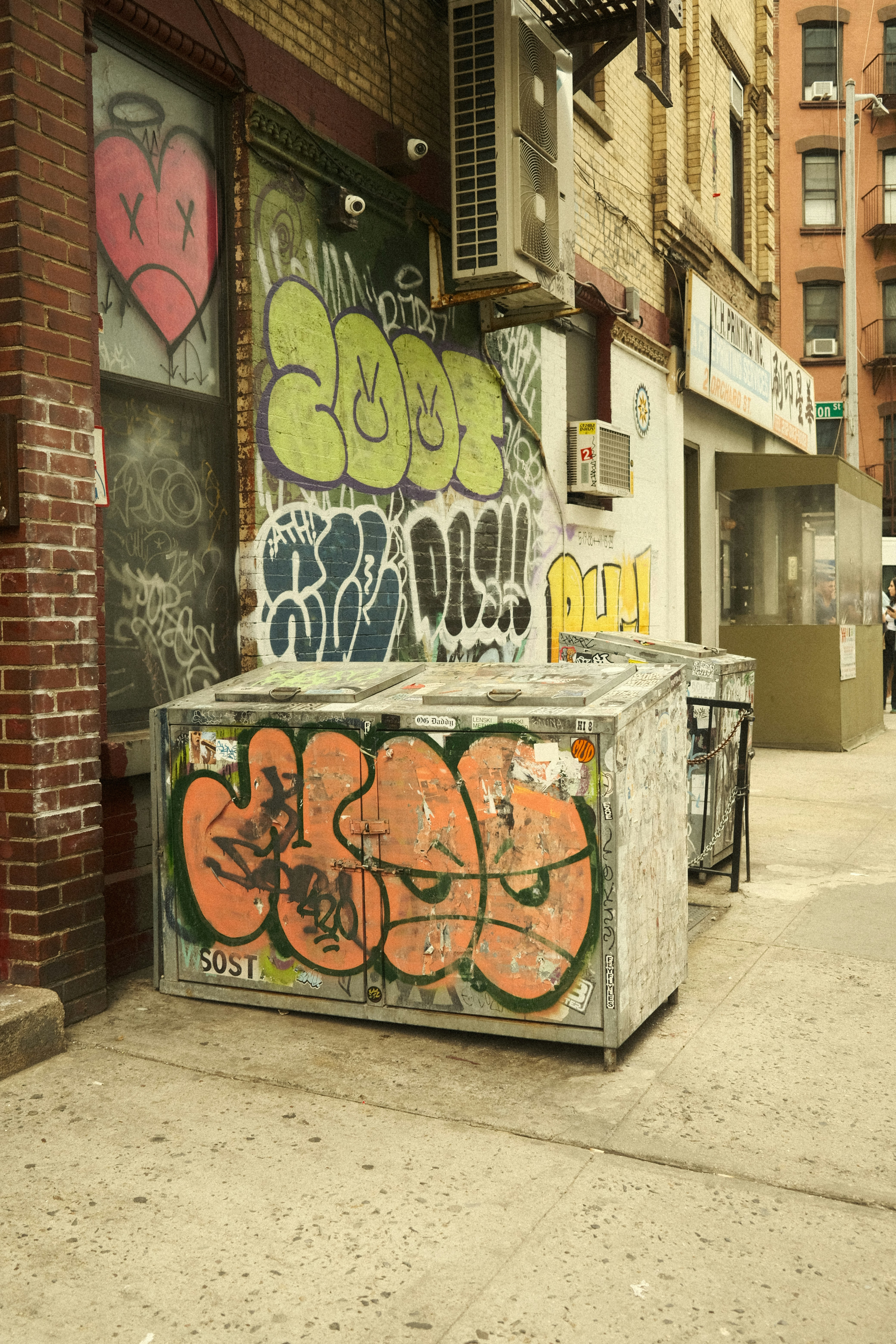 Graffiti covers a city street's buildings and objects. photo – Free Art ...