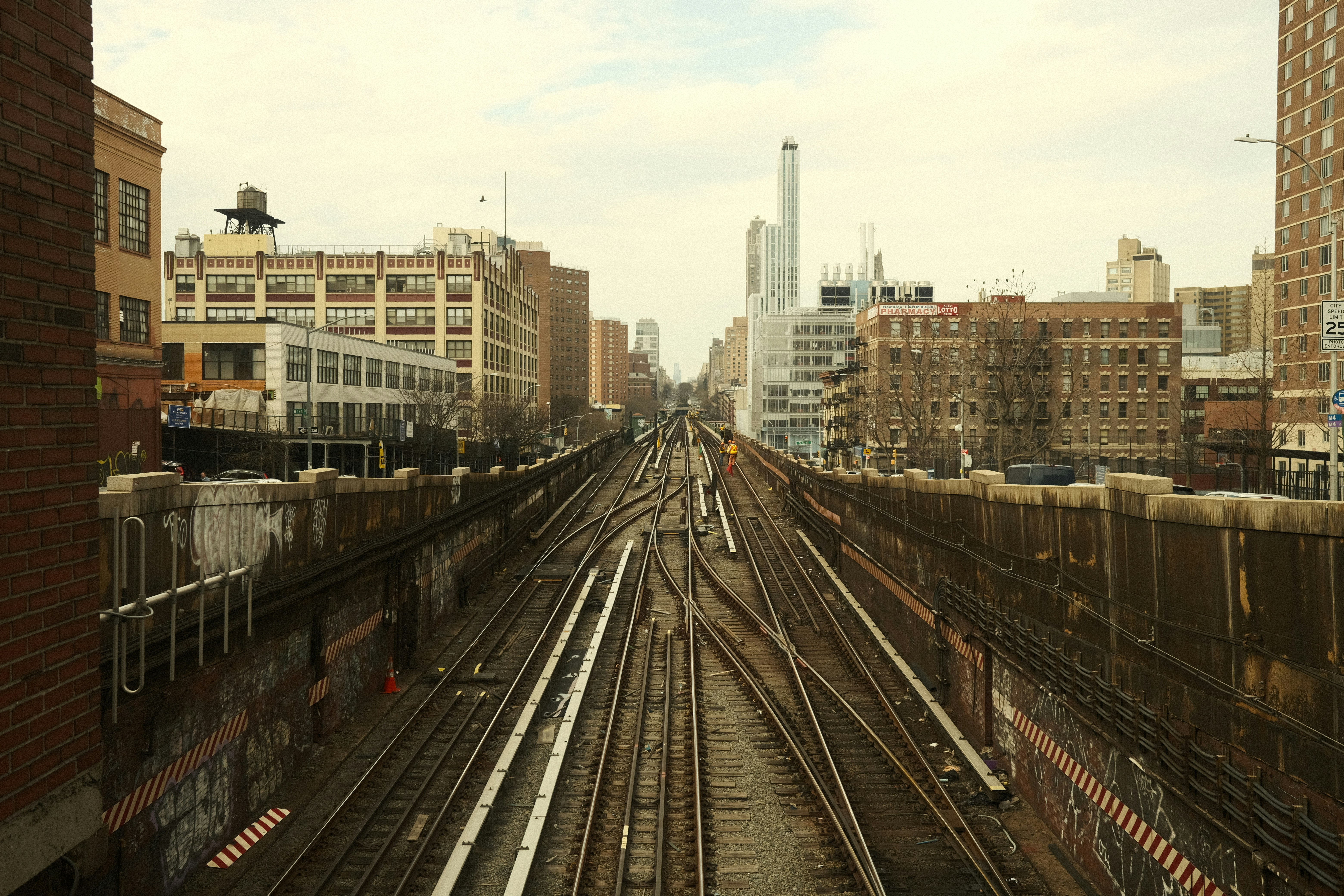 Train tracks lead through a city landscape. photo – Free Car Image on ...
