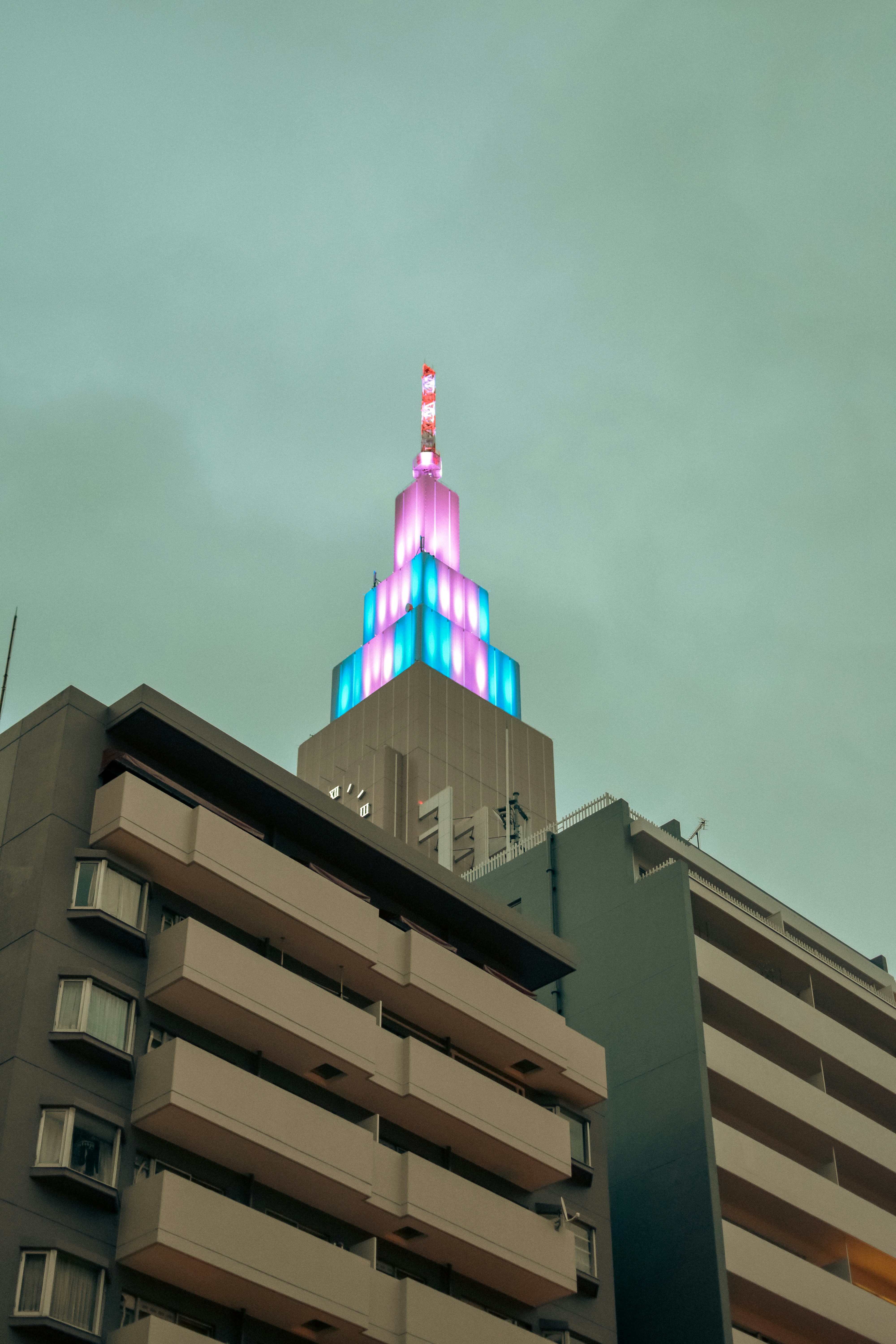 A colorful tower top reaches towards the sky.Mircea Solomiea