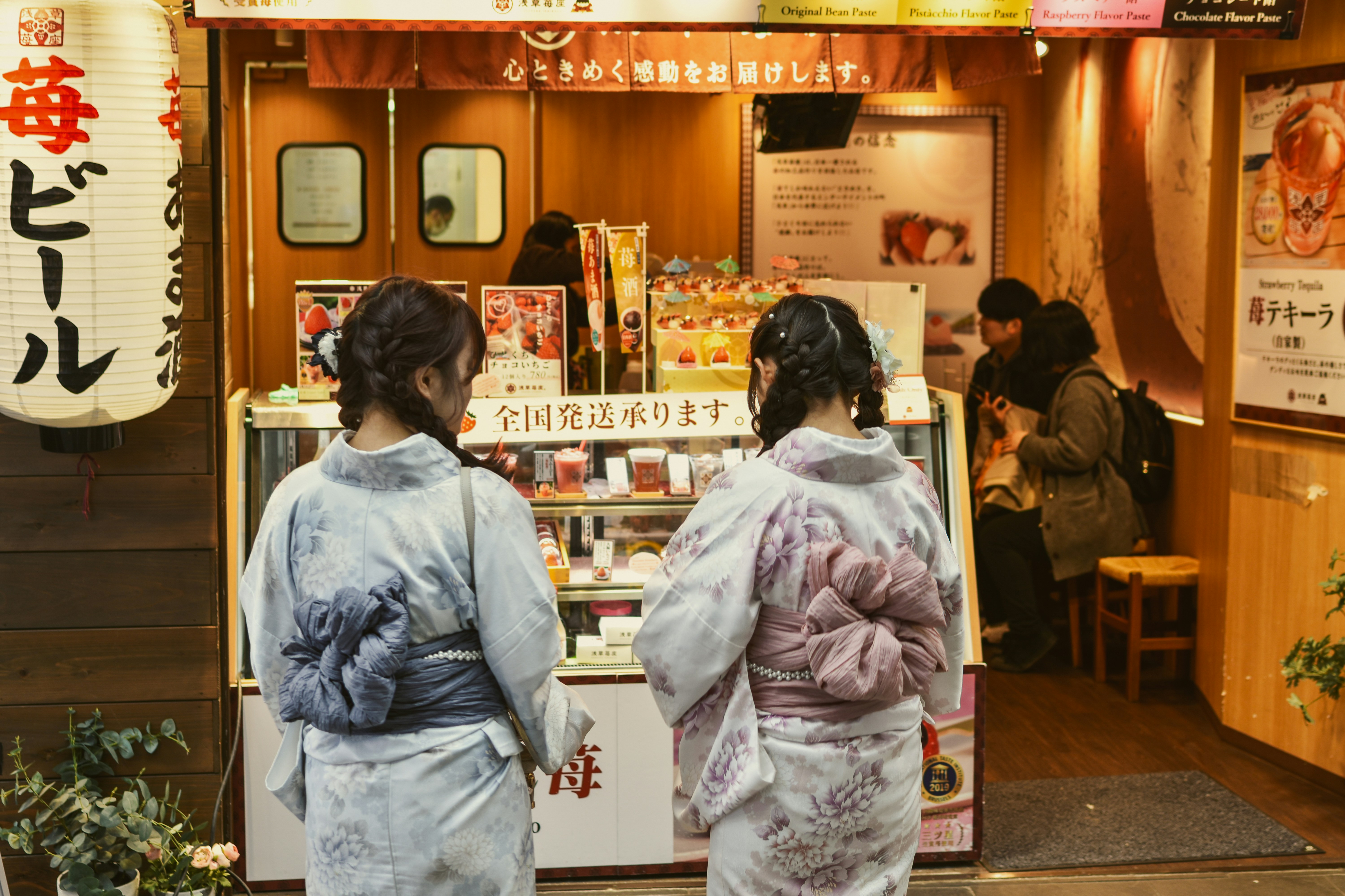 Lantern-lit Silhouettes at a Cozy Japanese Shopfront