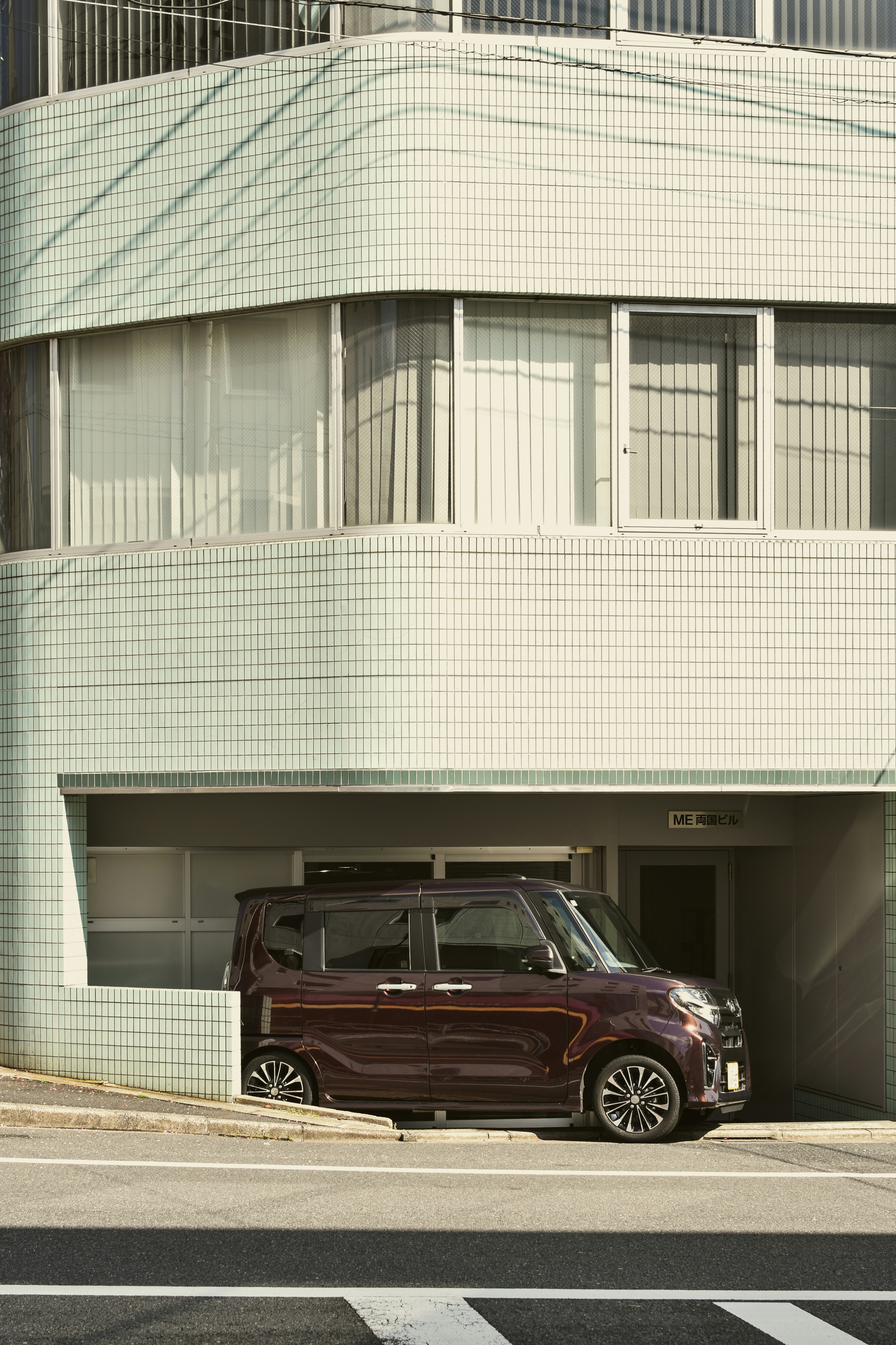 A maroon car parked under a building's overhang. photo – Free Vehicle ...