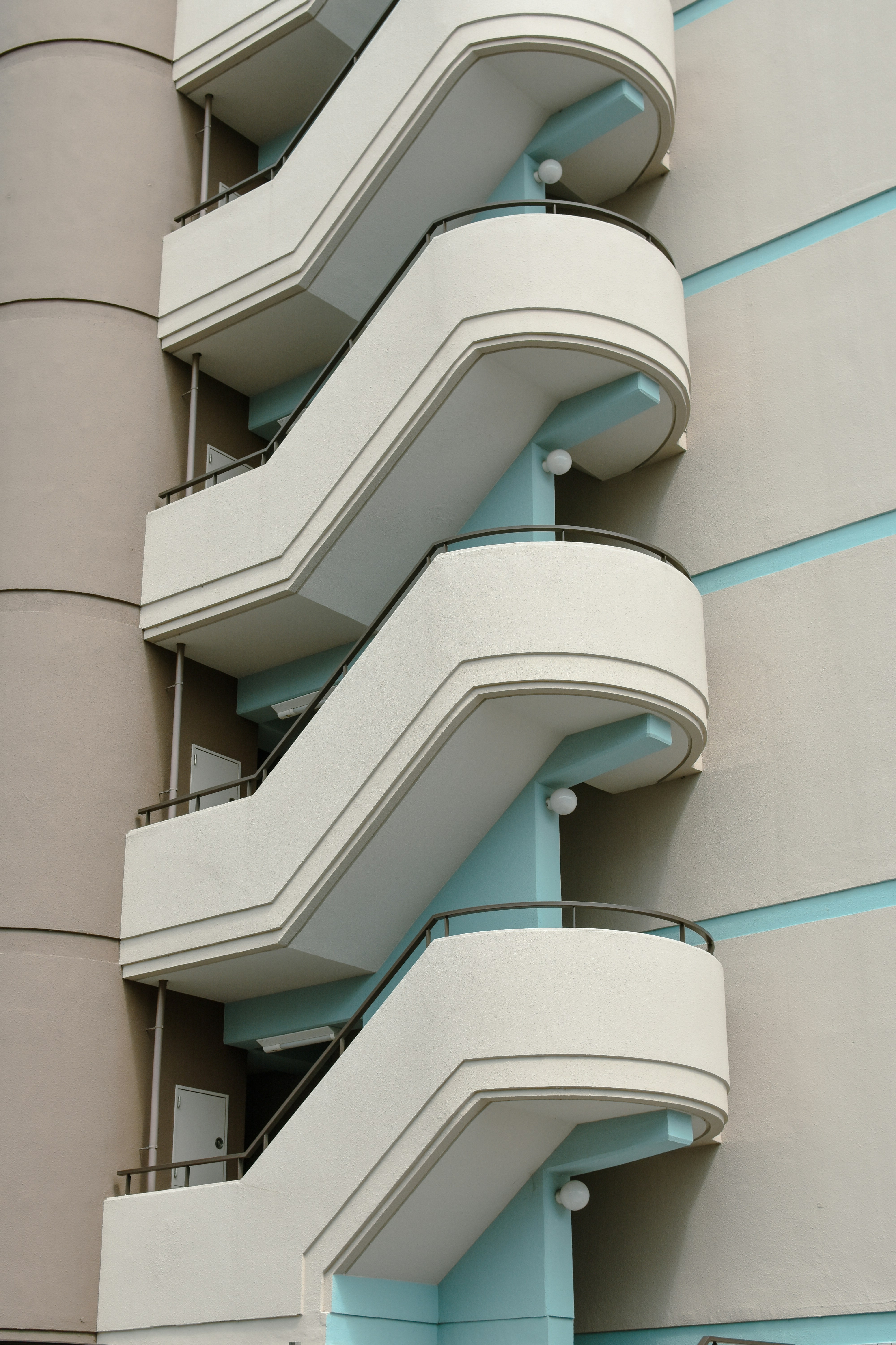 Cadence on the Facade: A Blue-Accented Exterior Staircase