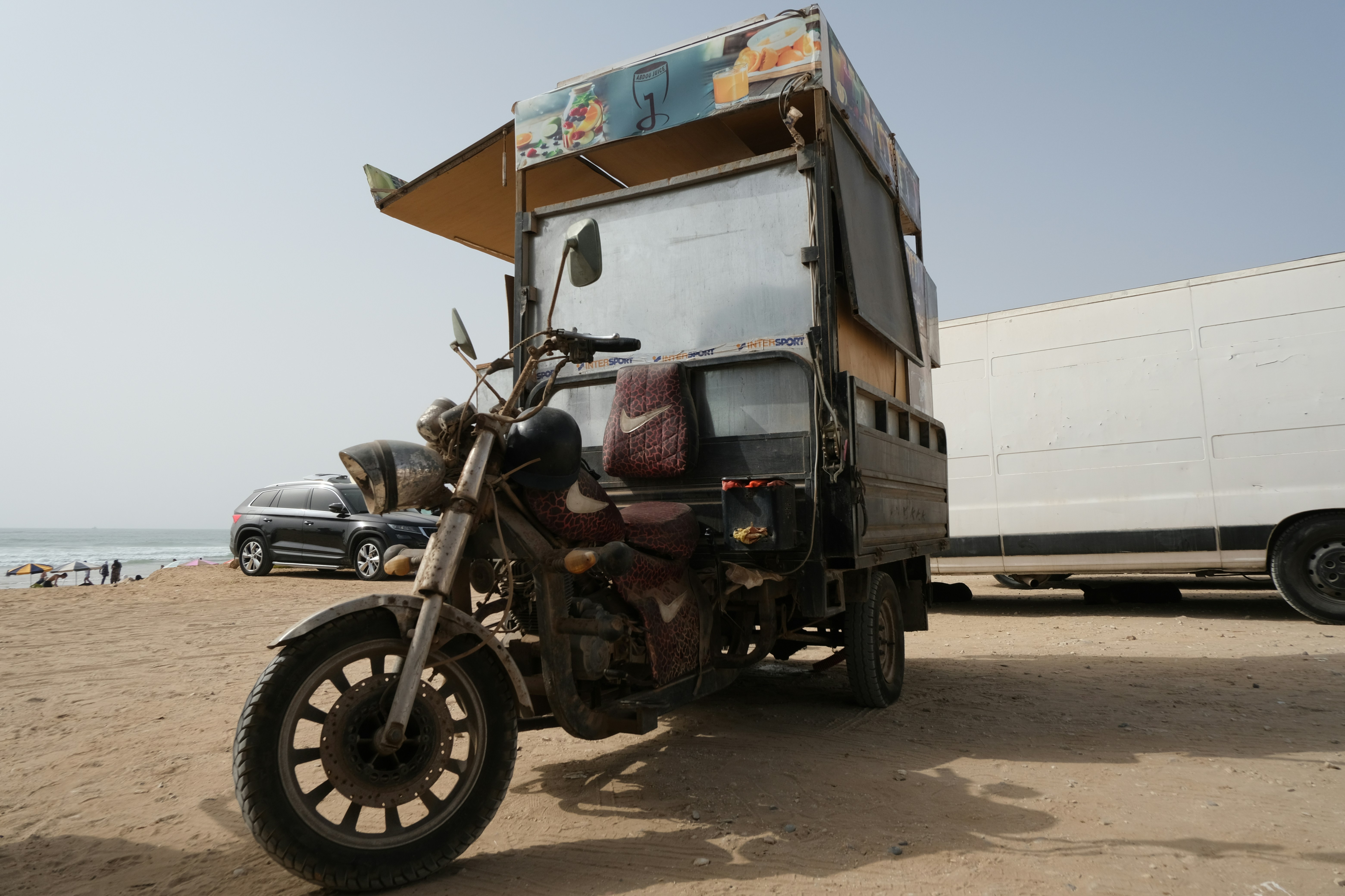 A modified motorcycle transports a large structure. photo – Free Car ...