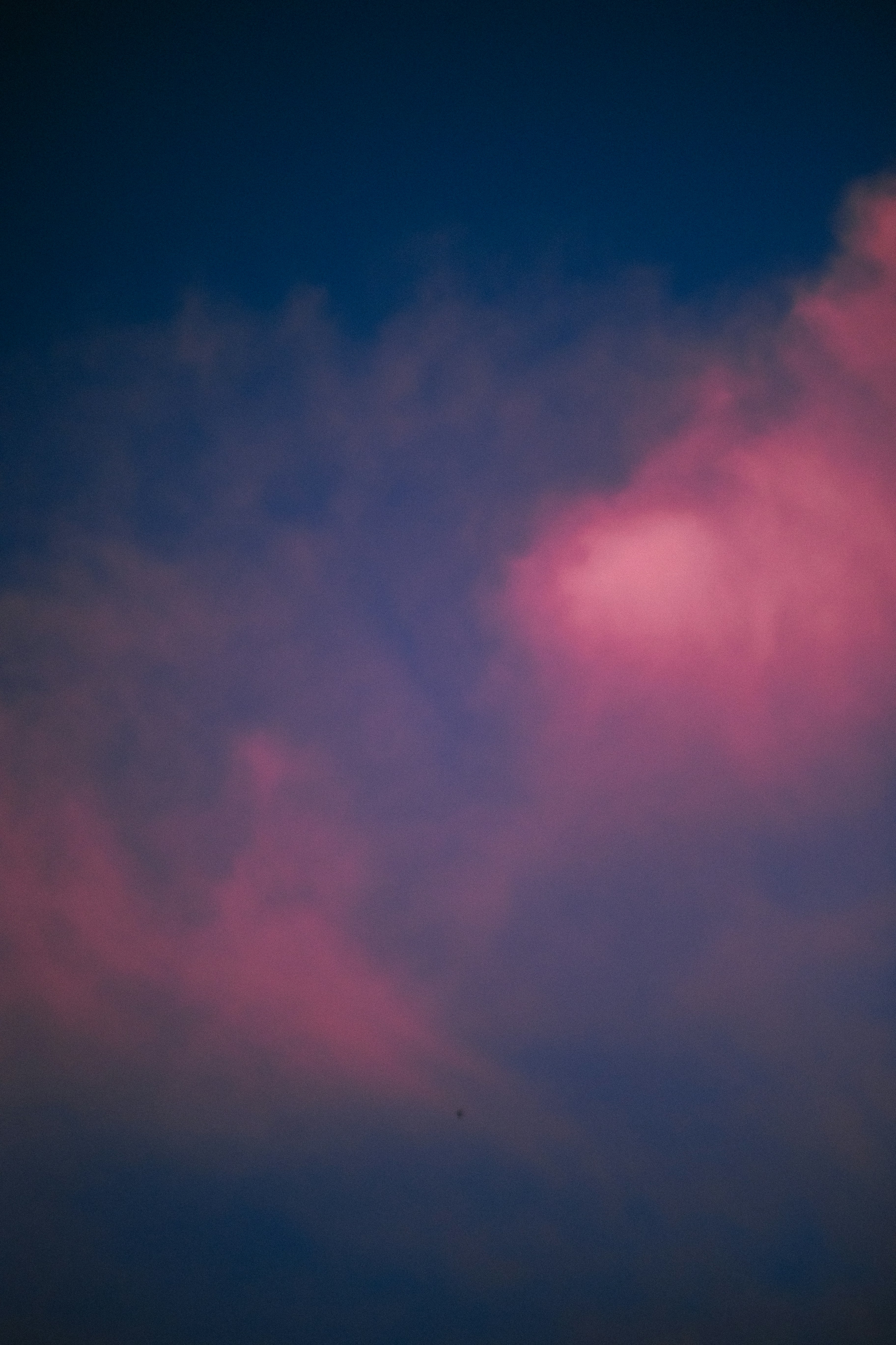Dusk-tinged Pink Veil Over a Cobalt Sky