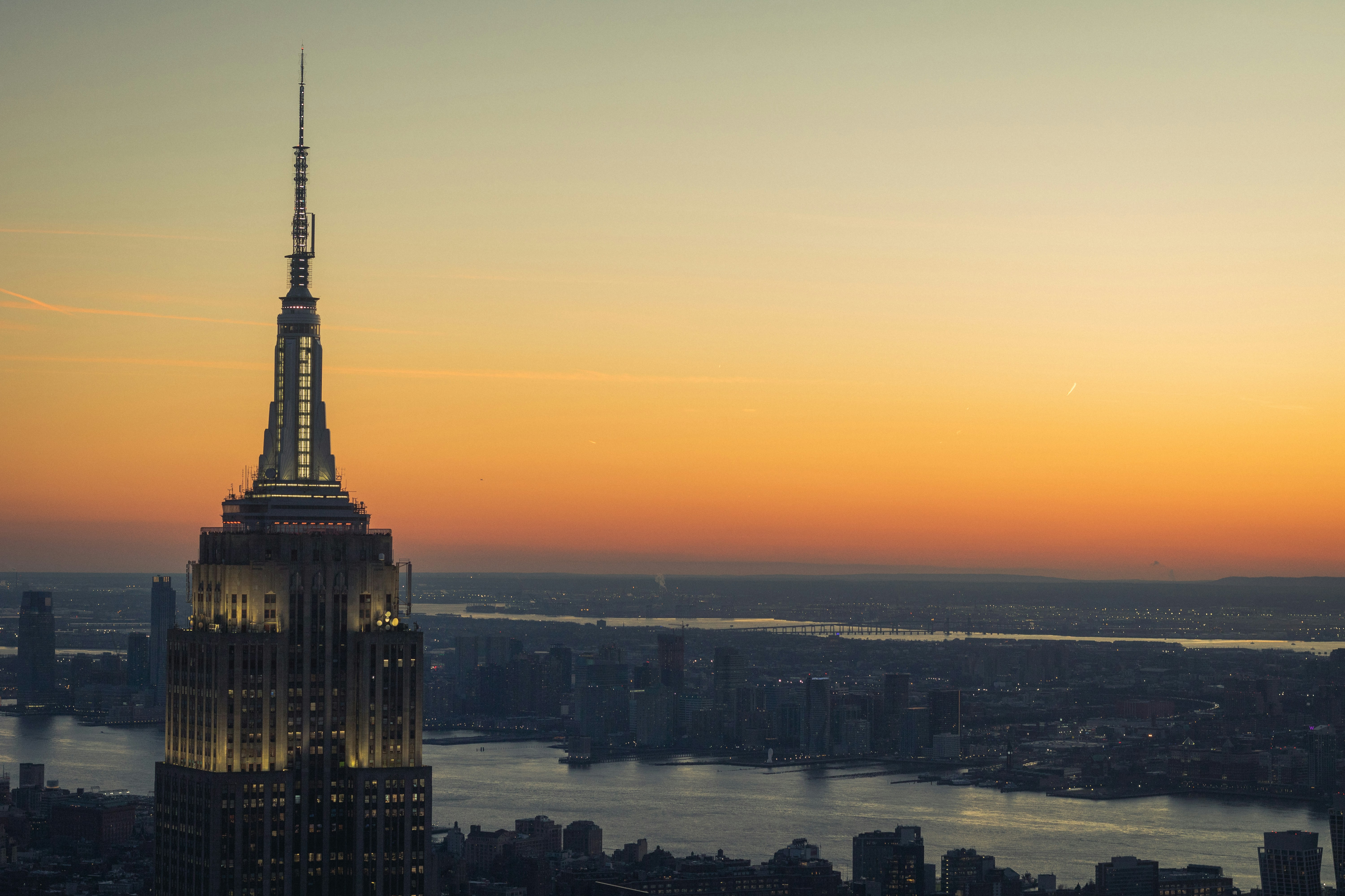 Empire State Building against a vibrant sunset skyline.