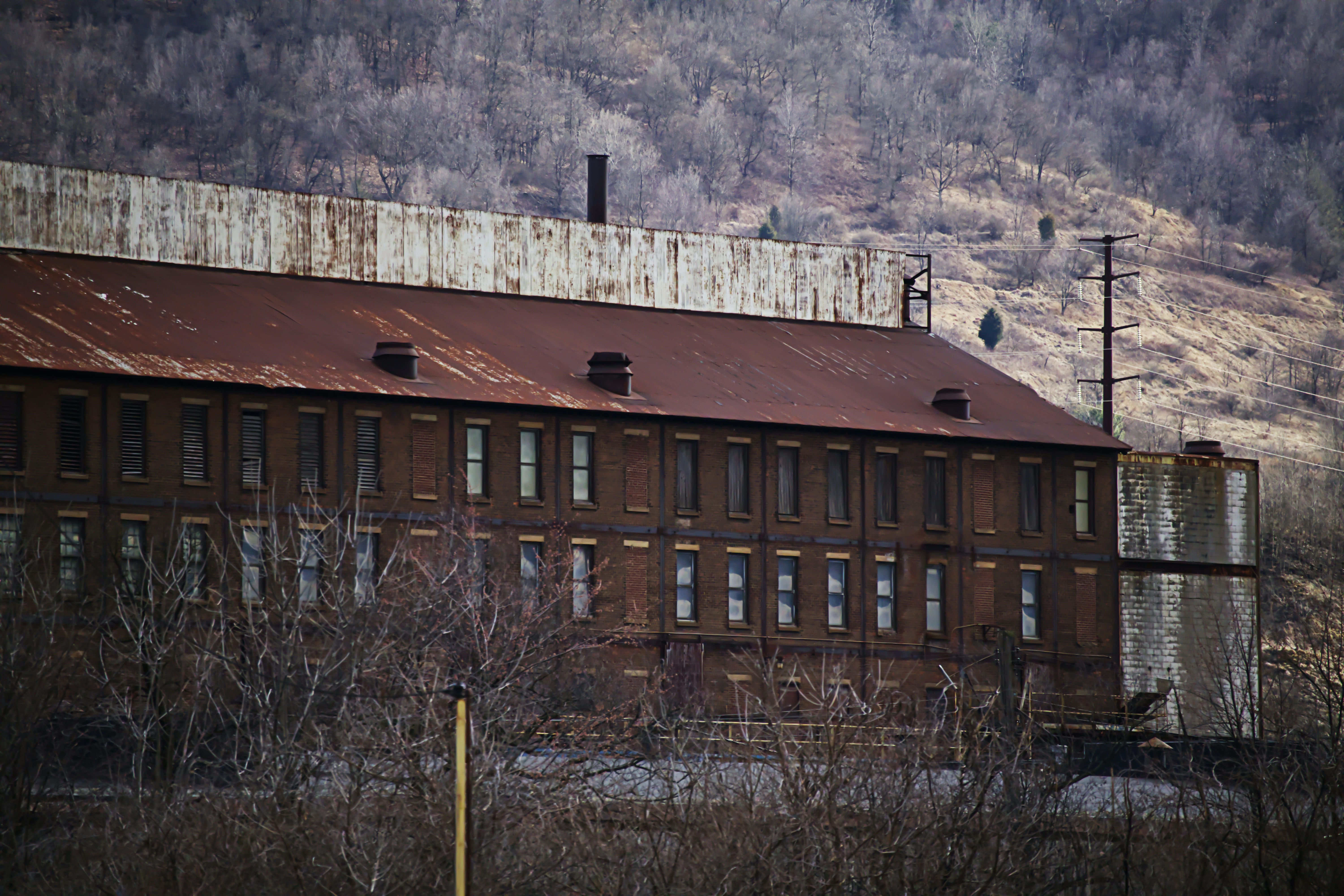 Rust-Washed Factory on a Quiet Hillside