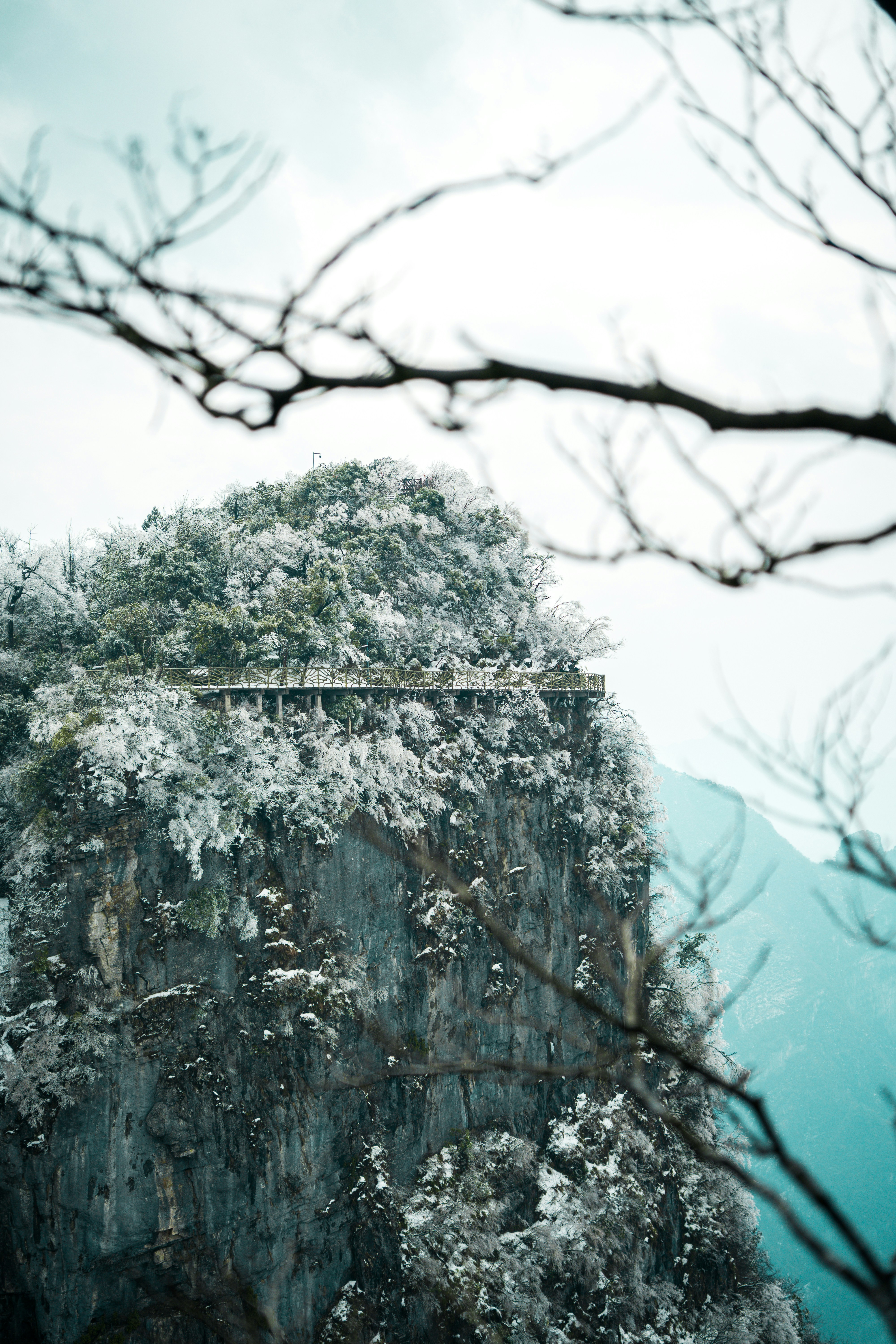 Snowy cliffside with a building at its peak. photo – Free Forest Image ...