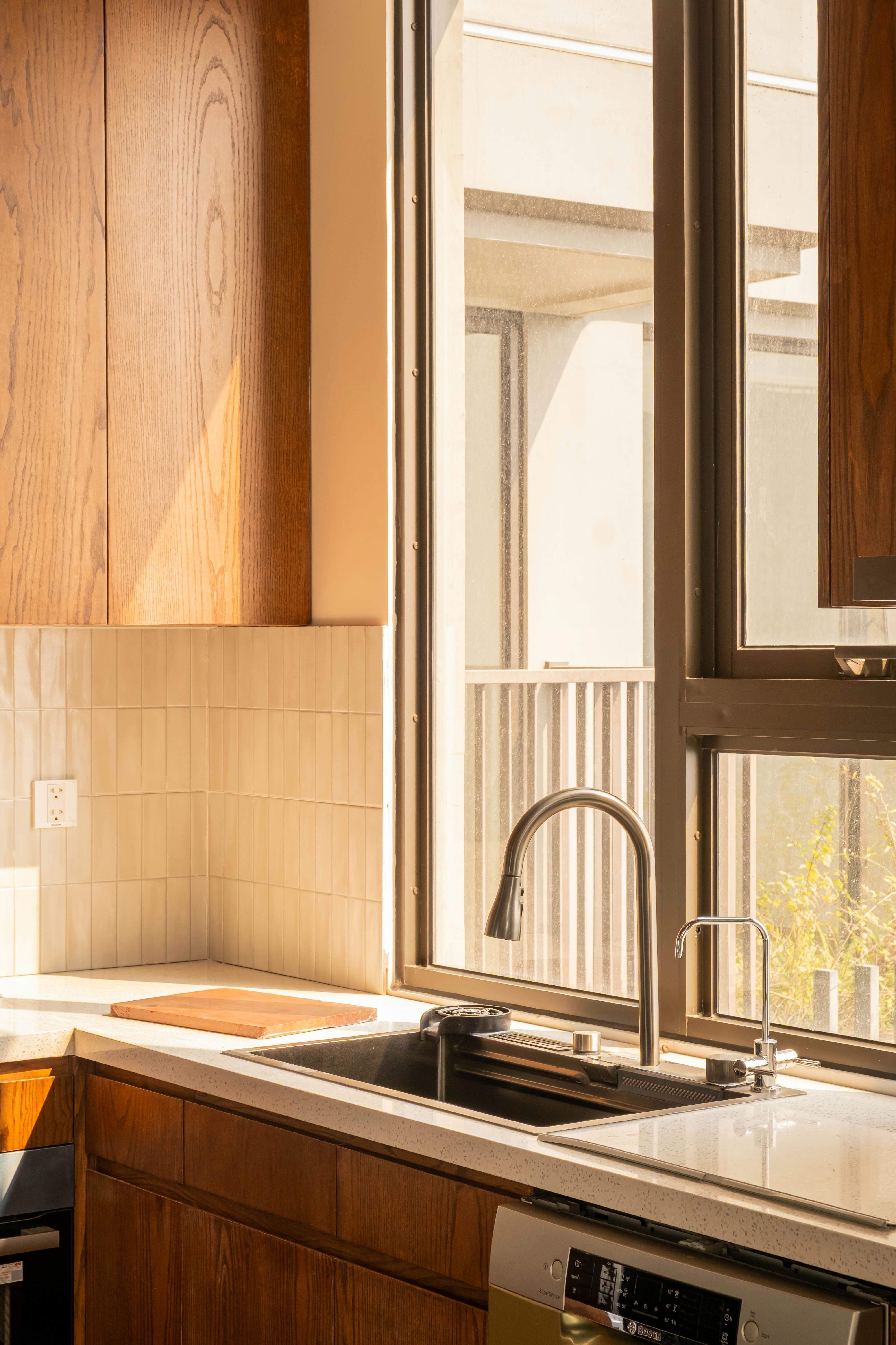 A modern kitchen with sink and natural light. photo – Free Interior ...