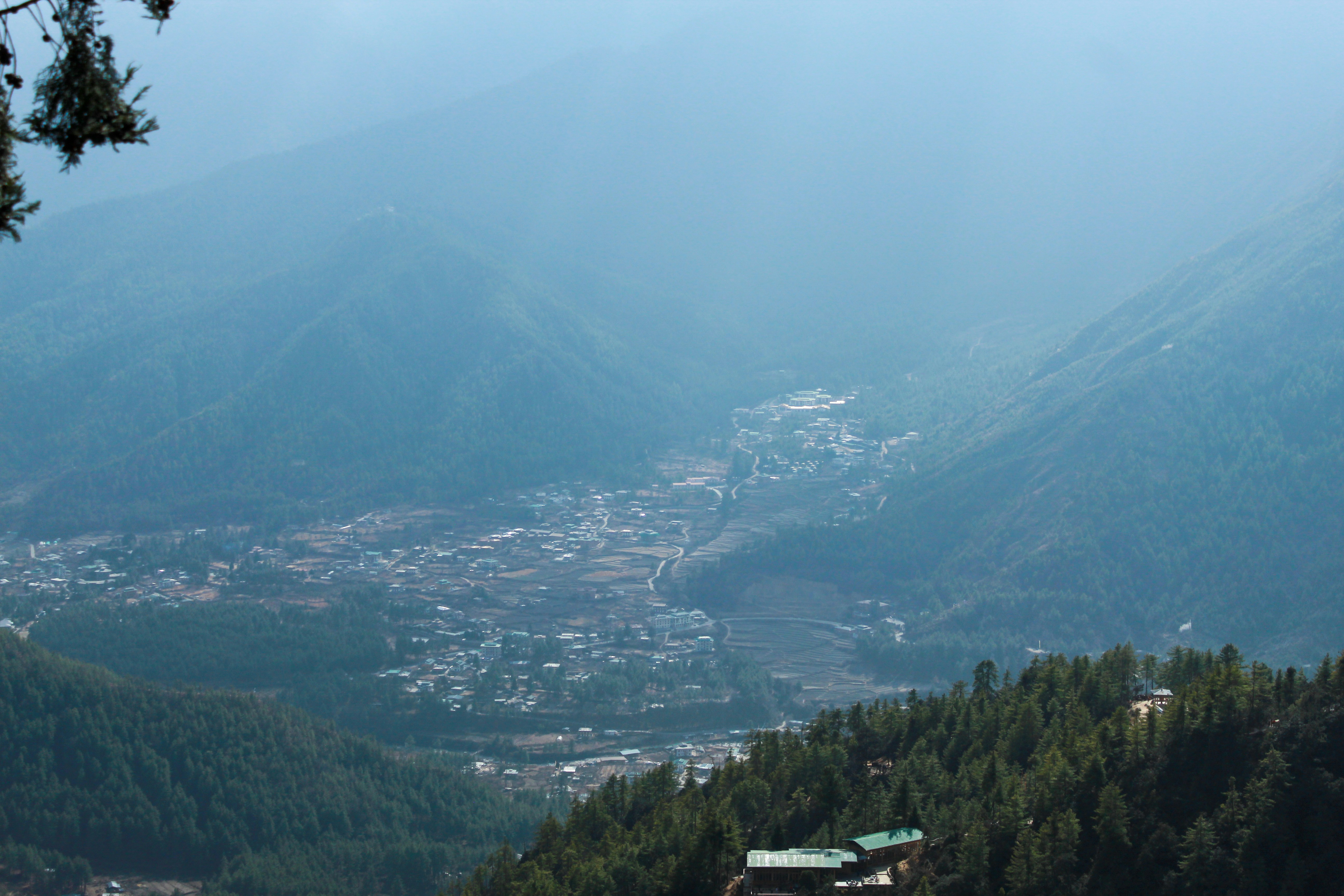 Distant town nestled between misty mountains. photo – Free Forest Image ...