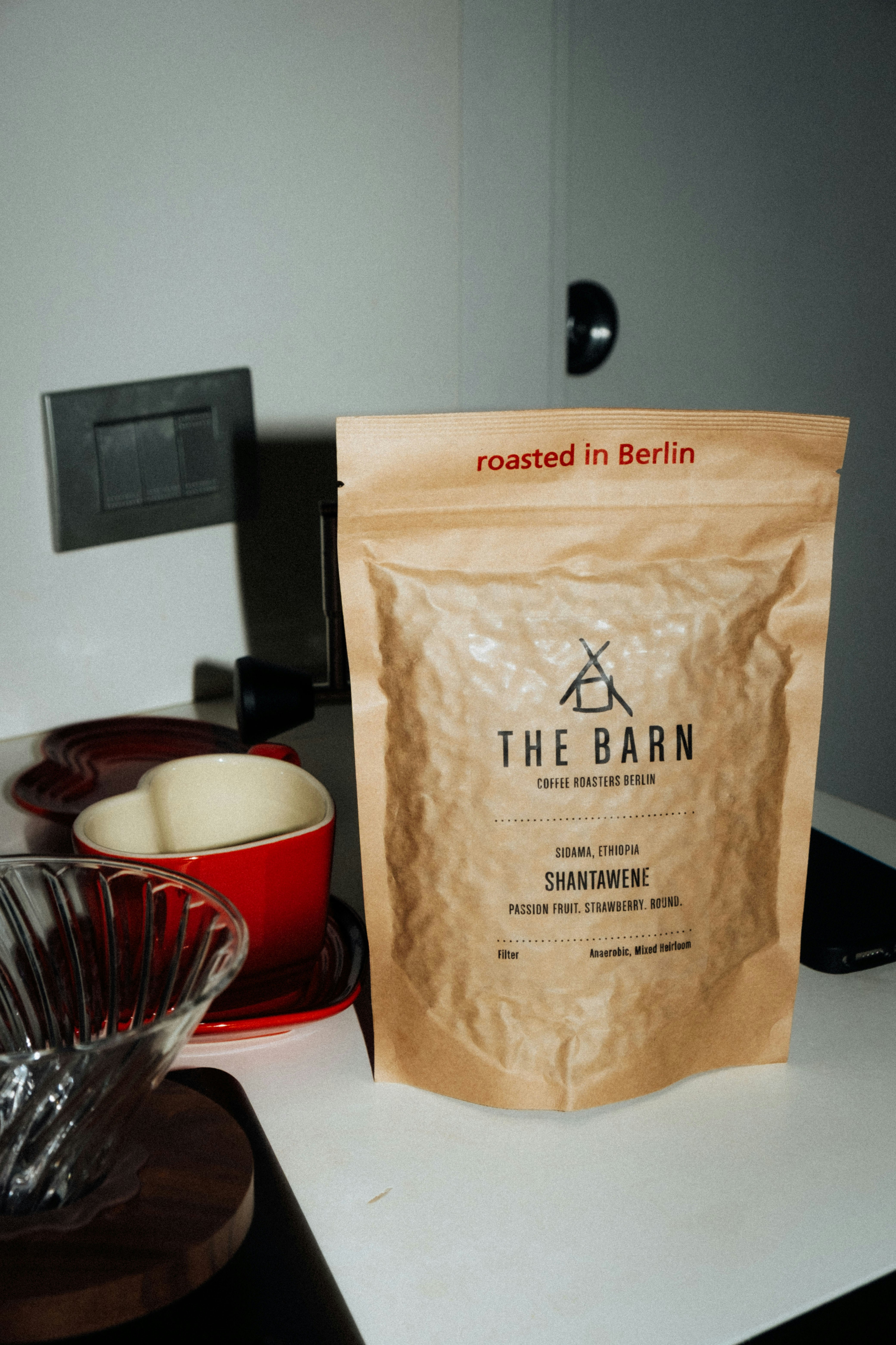 A bag of "the barn" coffee is shown. photo – Free Food Image on Unsplash