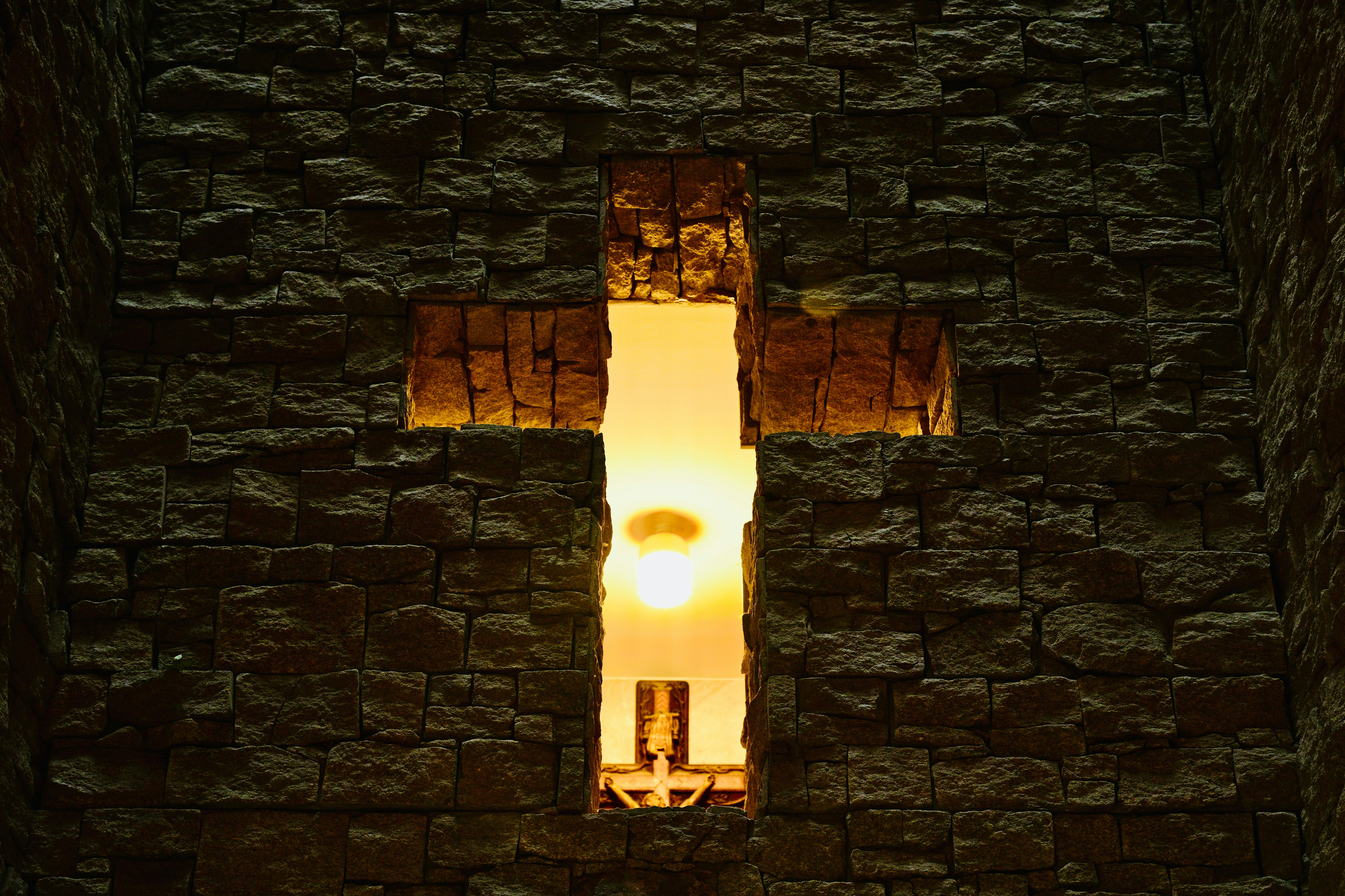 A cross-shaped window with light shining through. photo – Free Cross ...