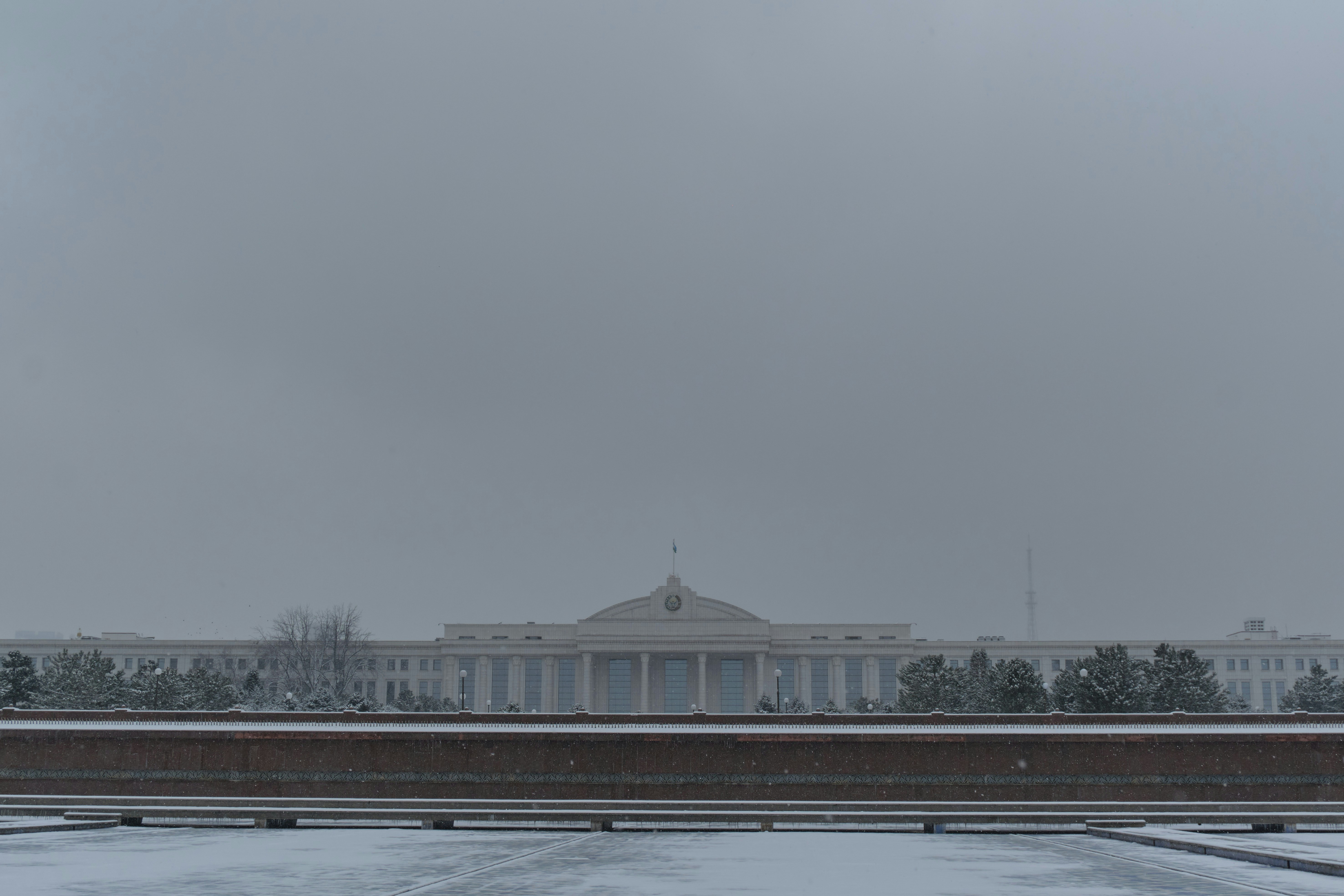 A building covered in snow during a storm. photo – Free Winter Image on ...