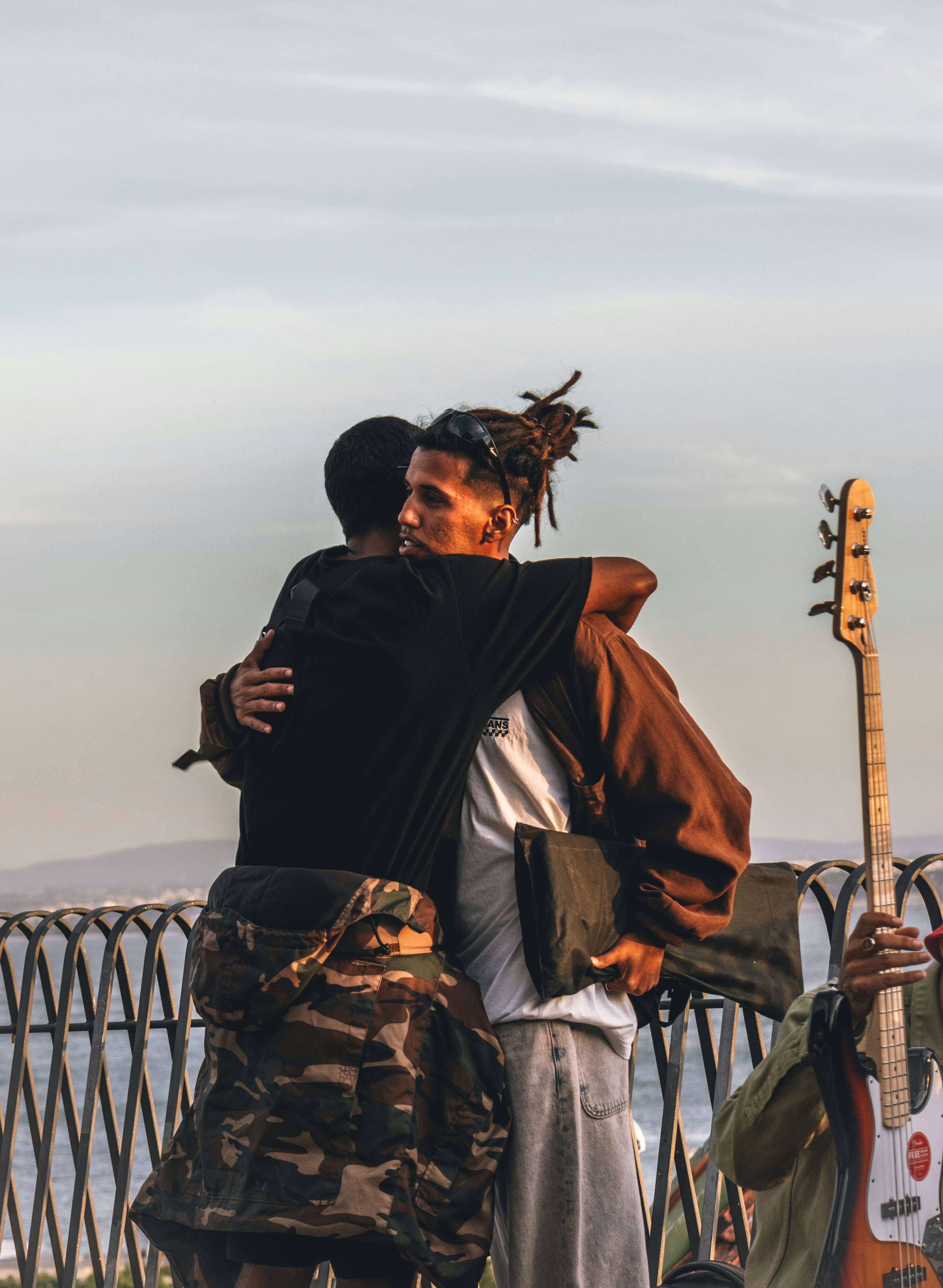 Two friends share a warm, friendly hug. photo – Free Portrait Image on ...