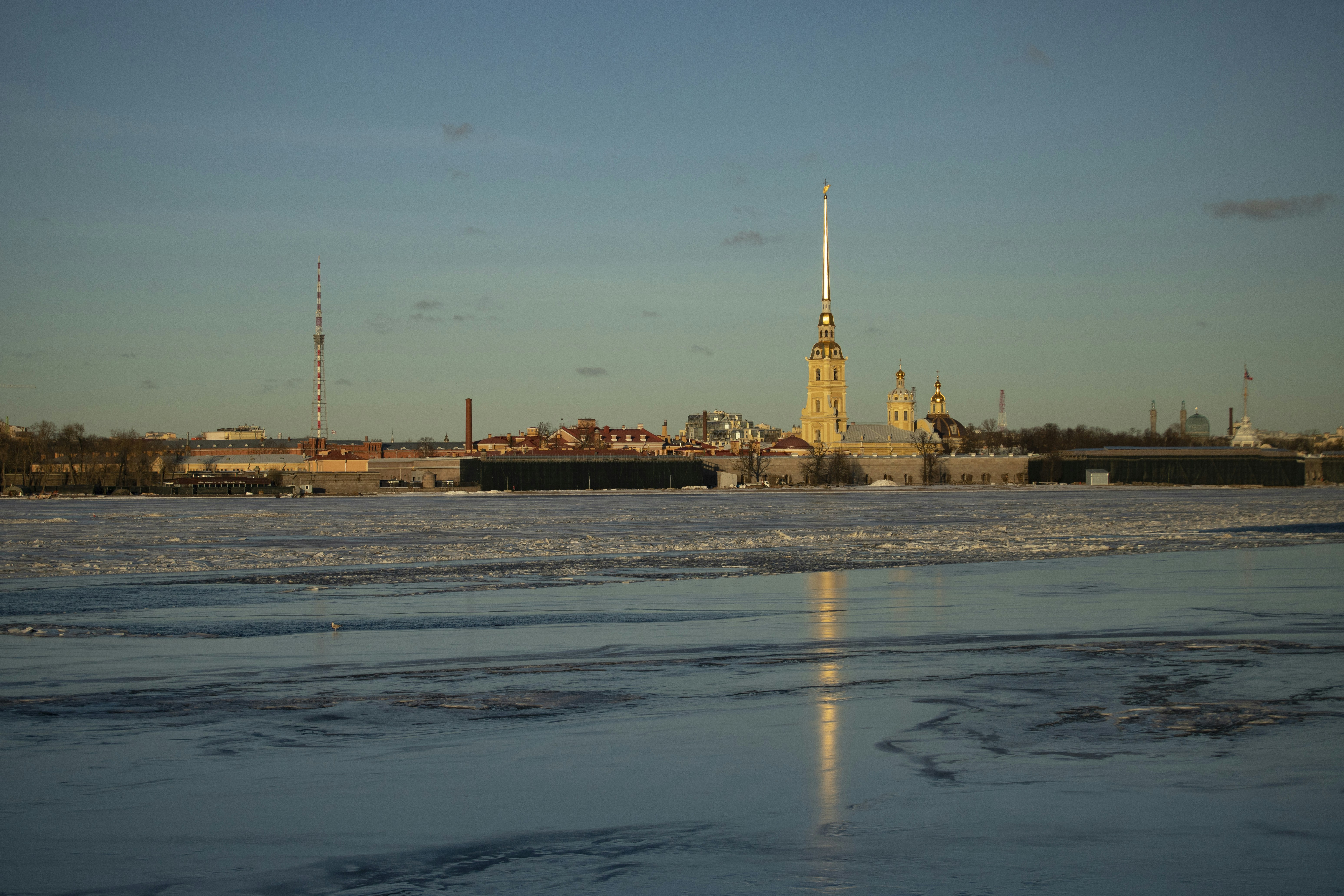A frozen river and a city skyline.