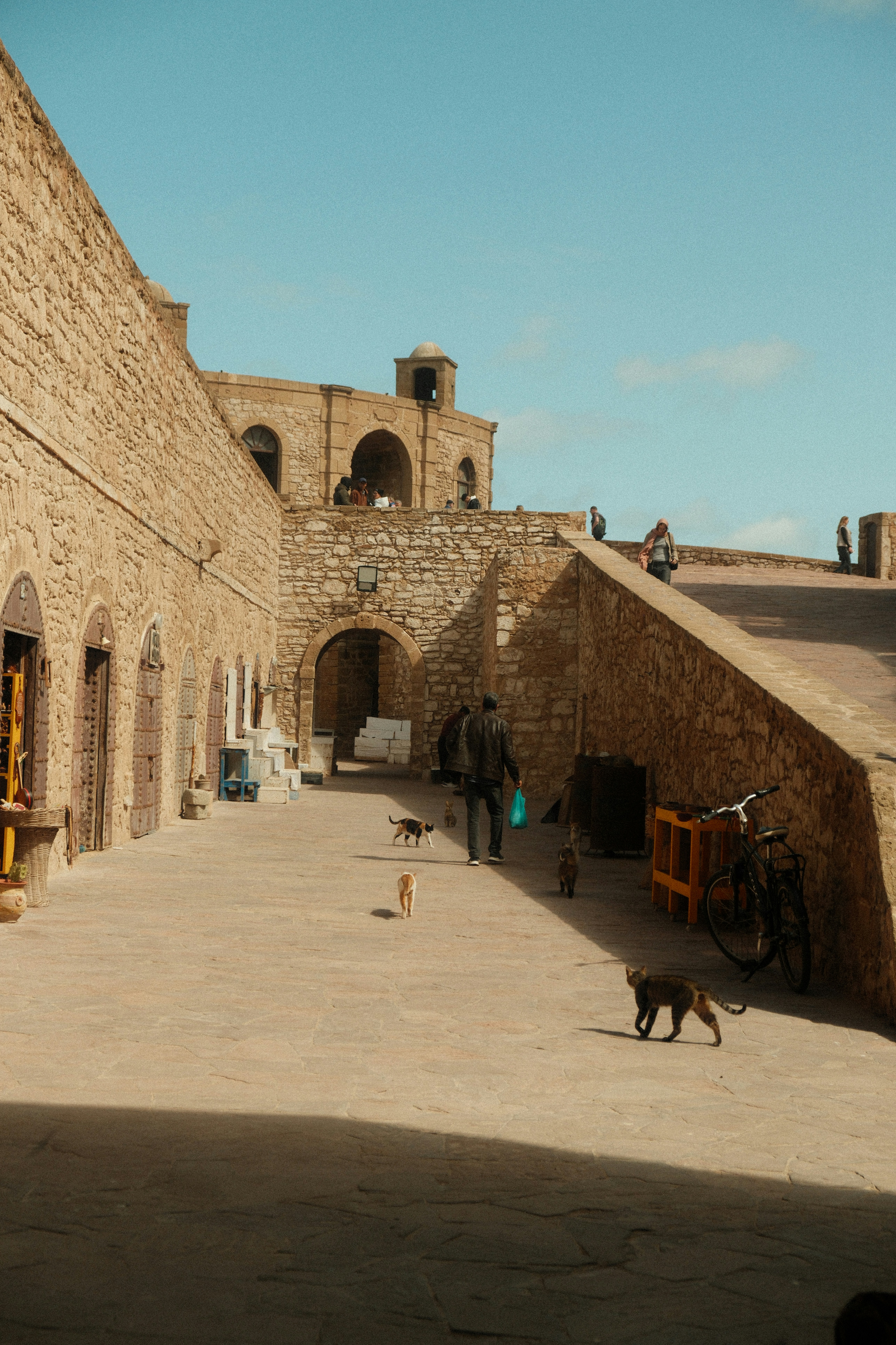 Turquoise Bag in a Sunlit Fortress Courtyard