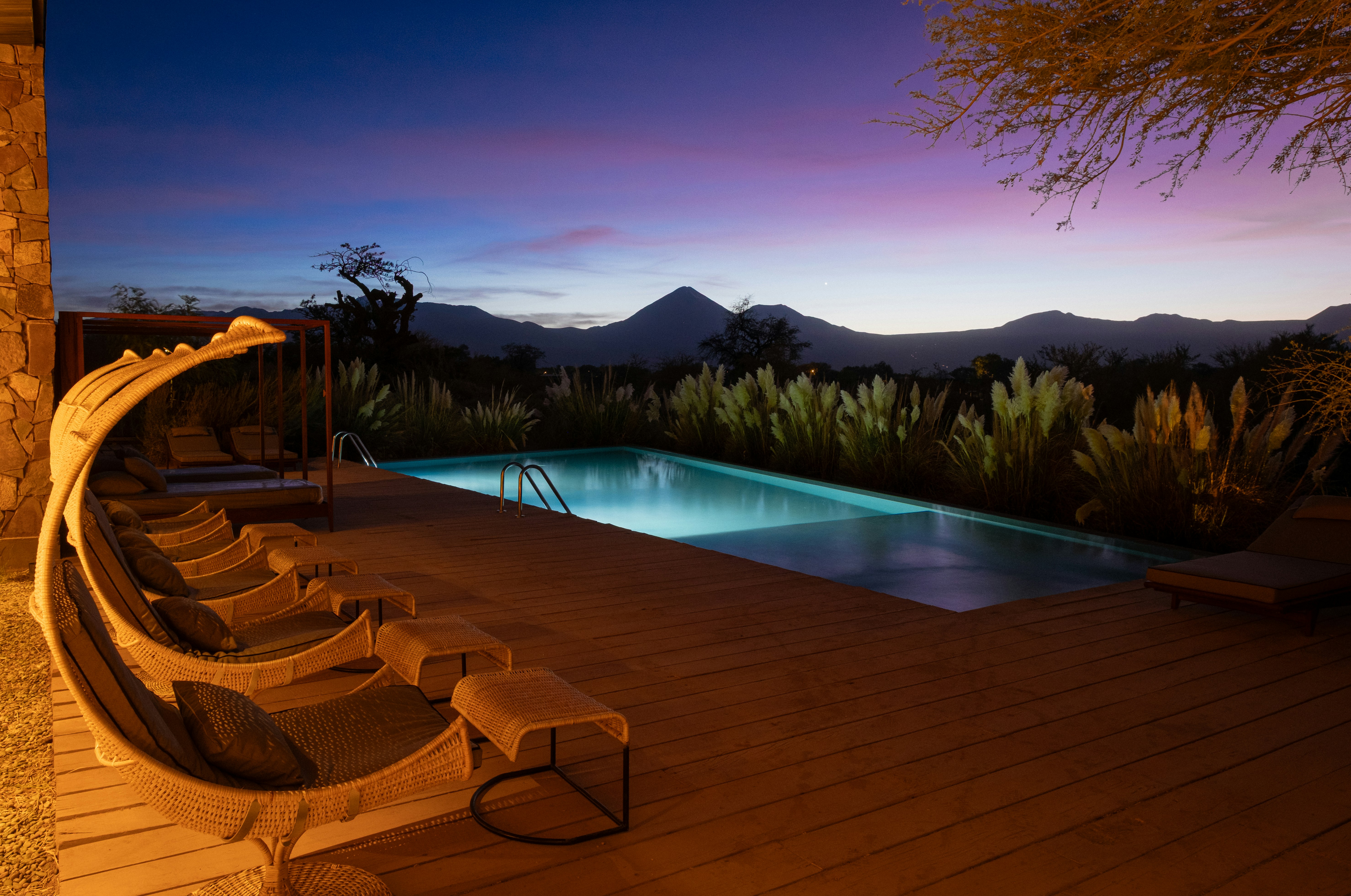 A pool overlooks a beautiful dusk mountain view. photo – Free Travel ...