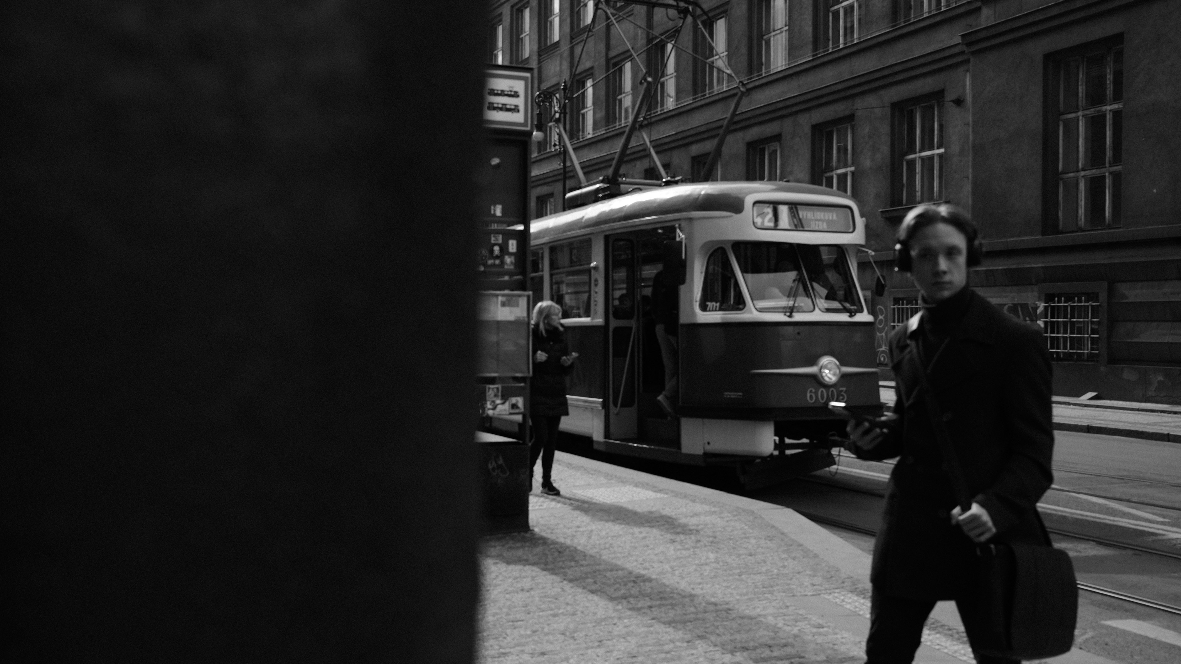 A black and white street scene with a tram. photo – Free Wallpaper ...