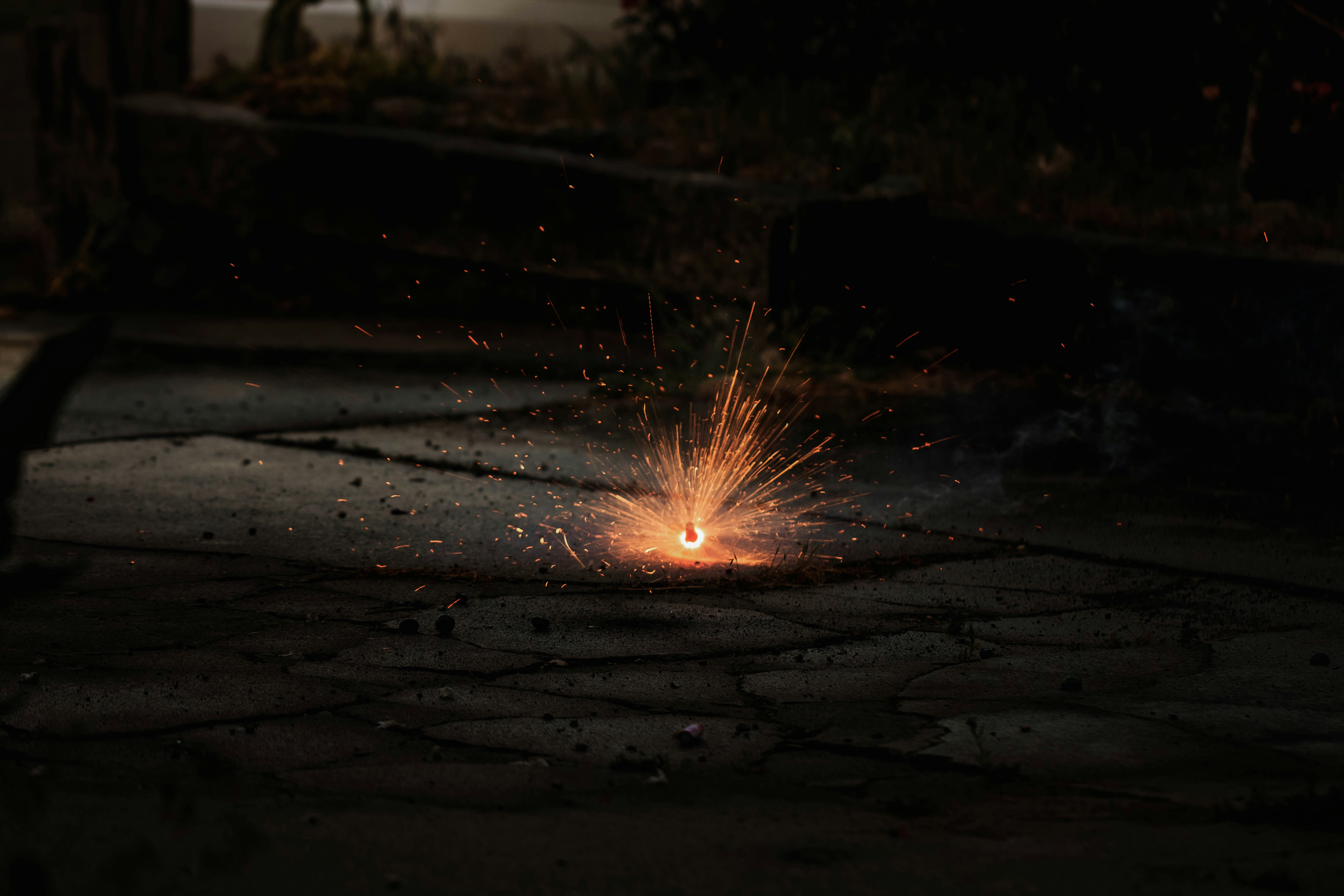 Firecracker exploding on the ground with sparks. photo – Free Image on ...