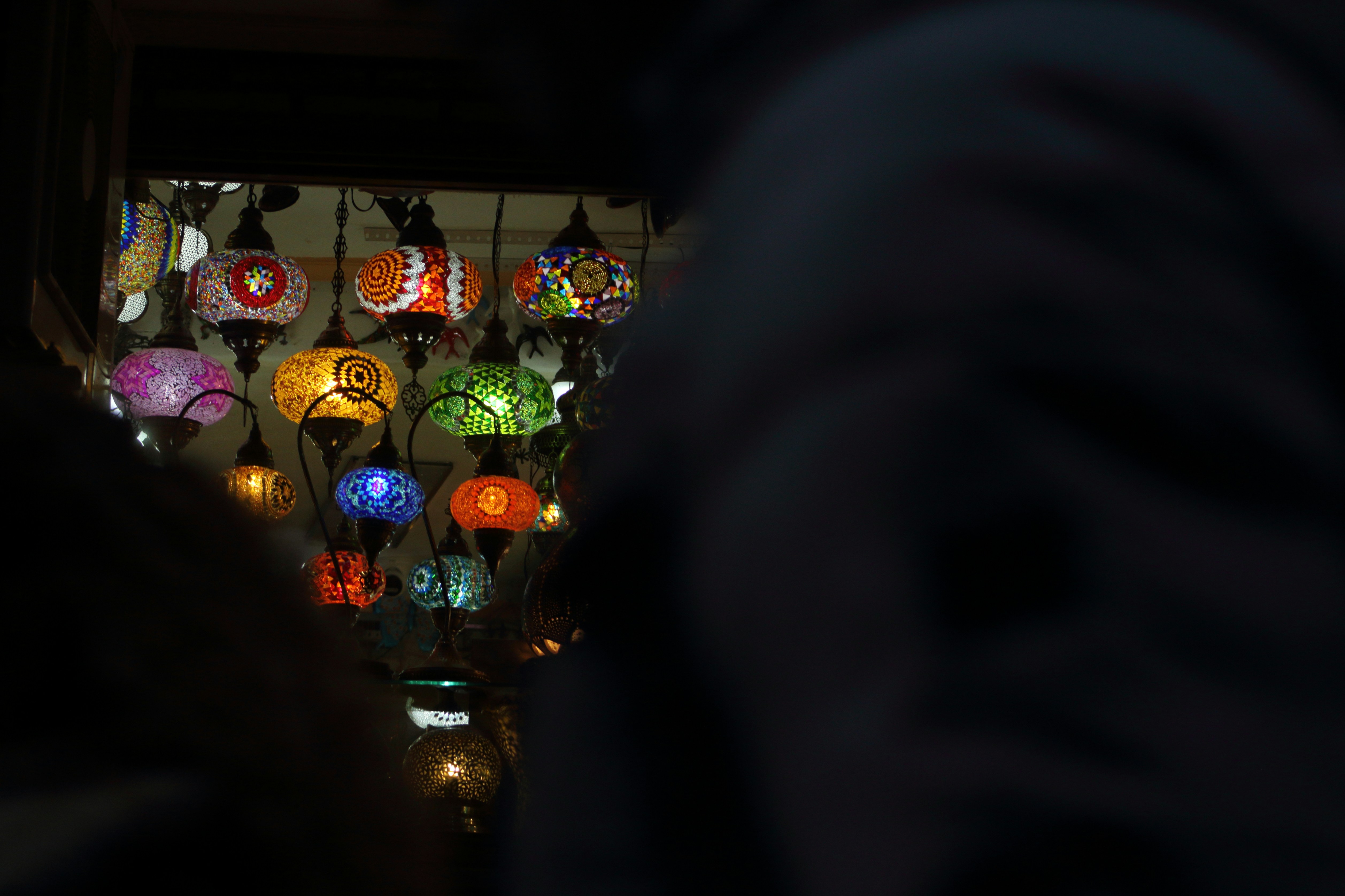 Colorful lamps brighten a dim market. photo – Free Art Image on Unsplash