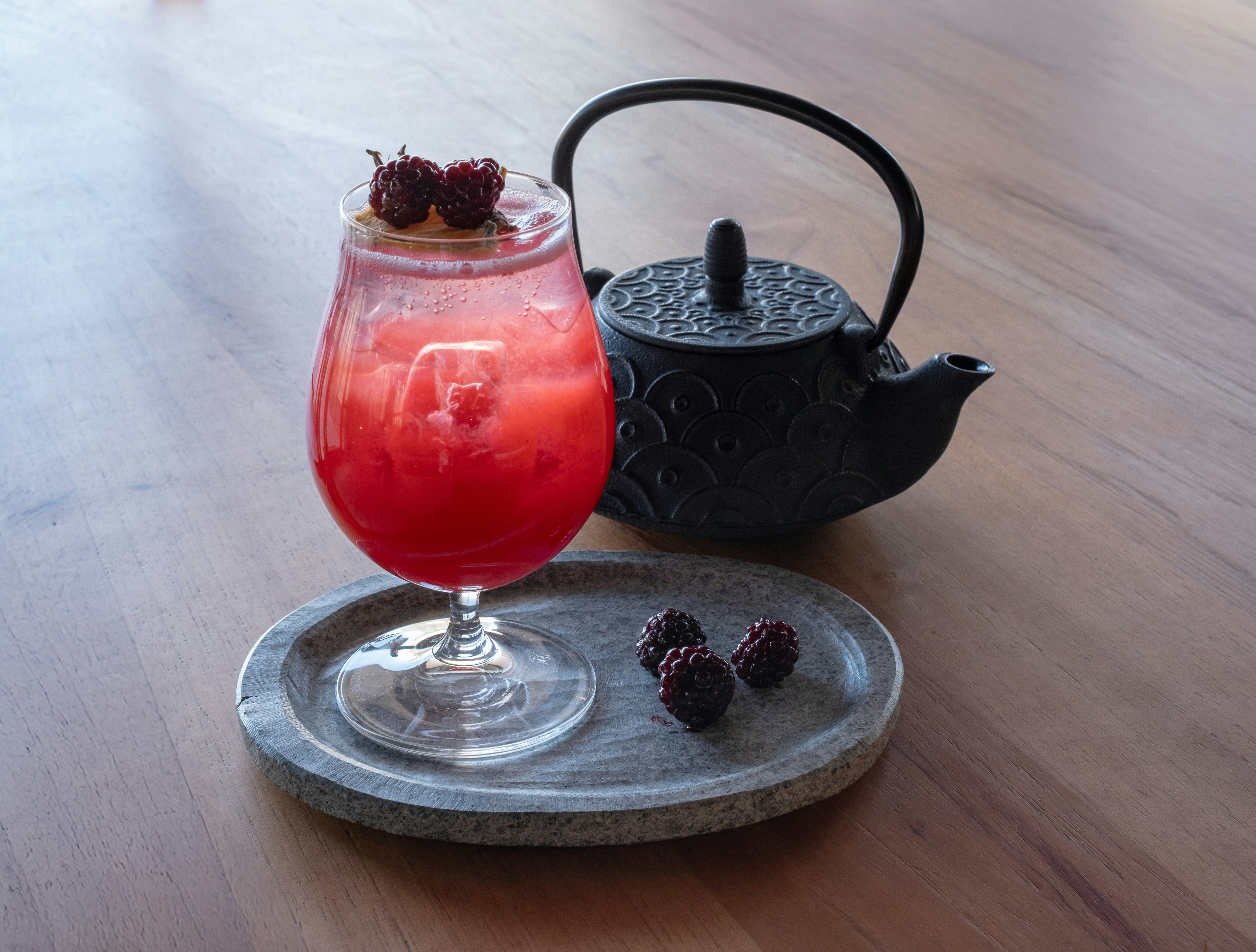 A refreshing cocktail and tea pot are displayed. photo – Free Food ...