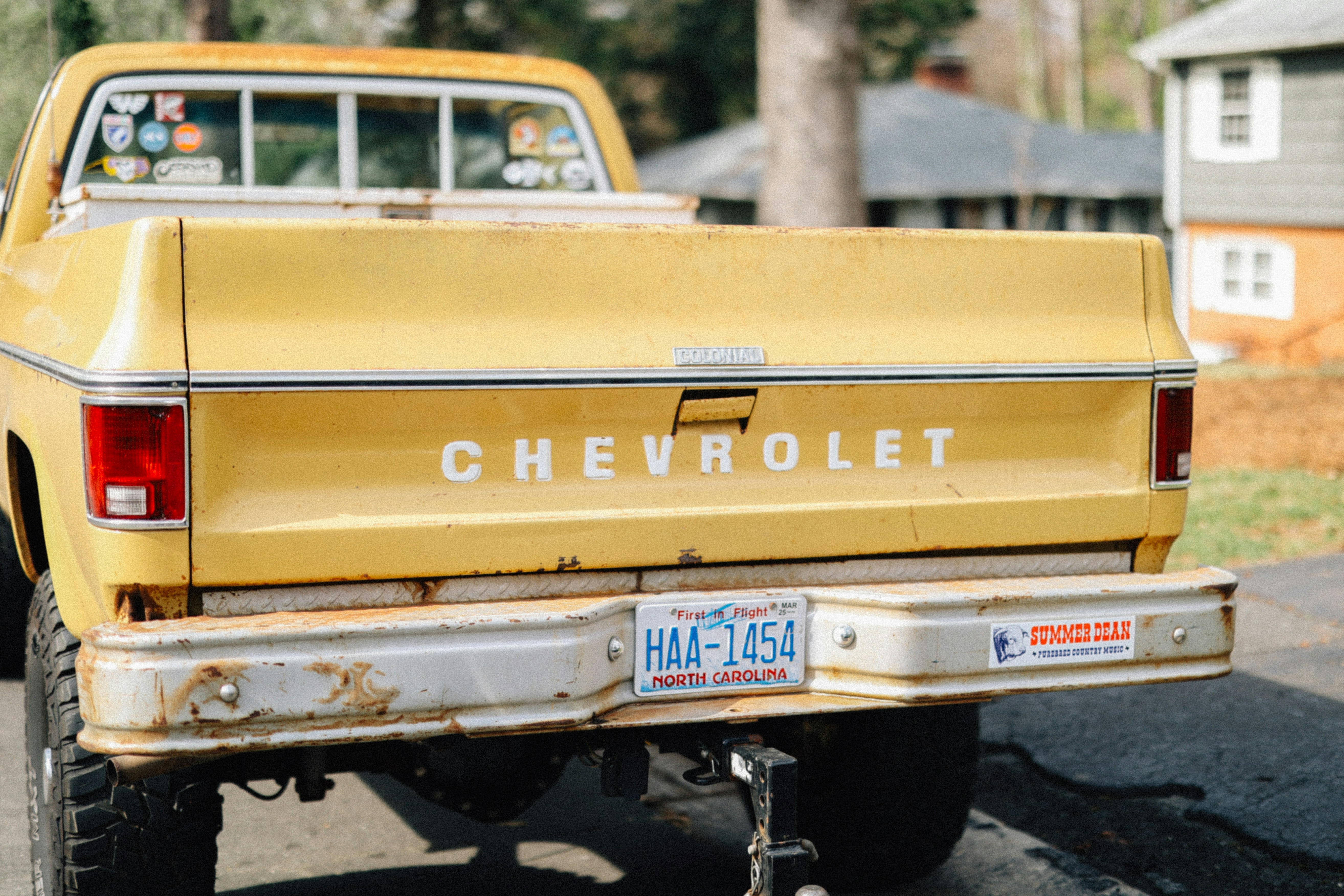 Yellow chevrolet truck rear view is pictured. photo – Free Image on ...